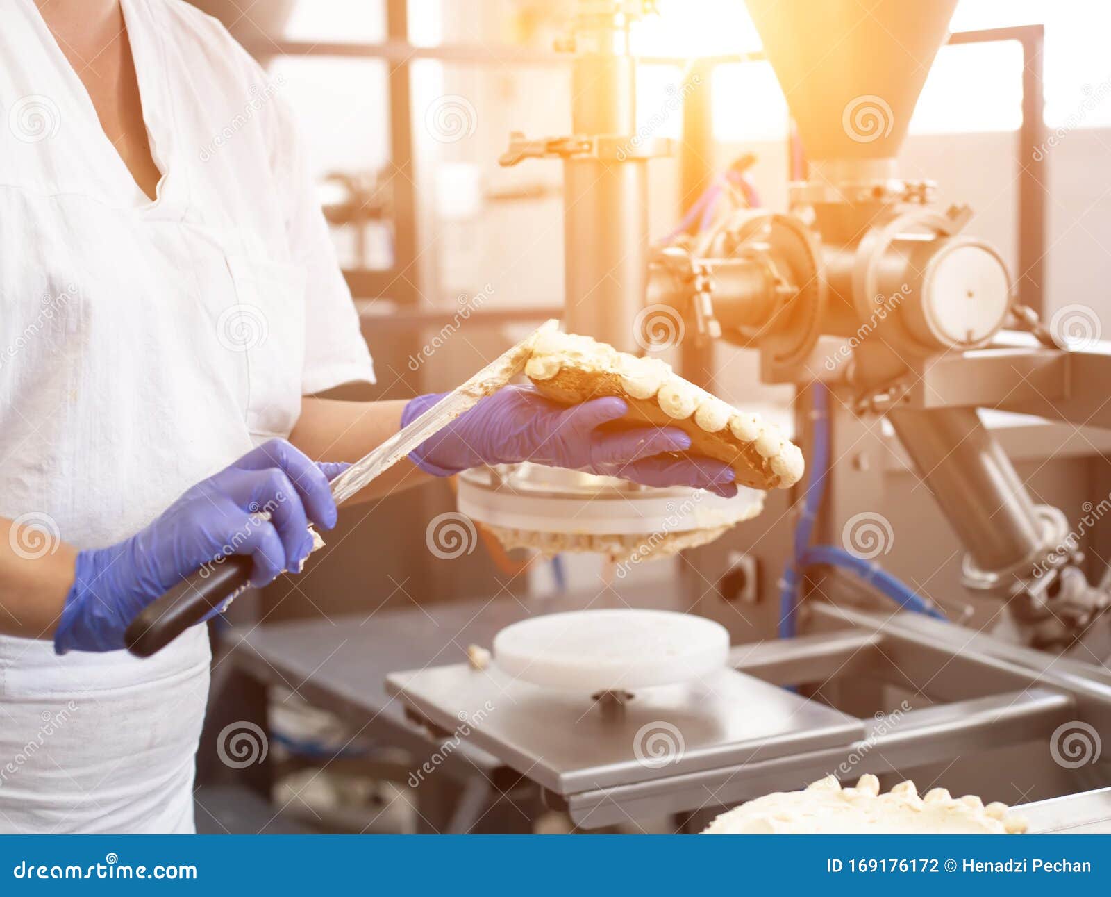 The Pastry Chef Makes Cake Using Modern Equipment for the Production of ...