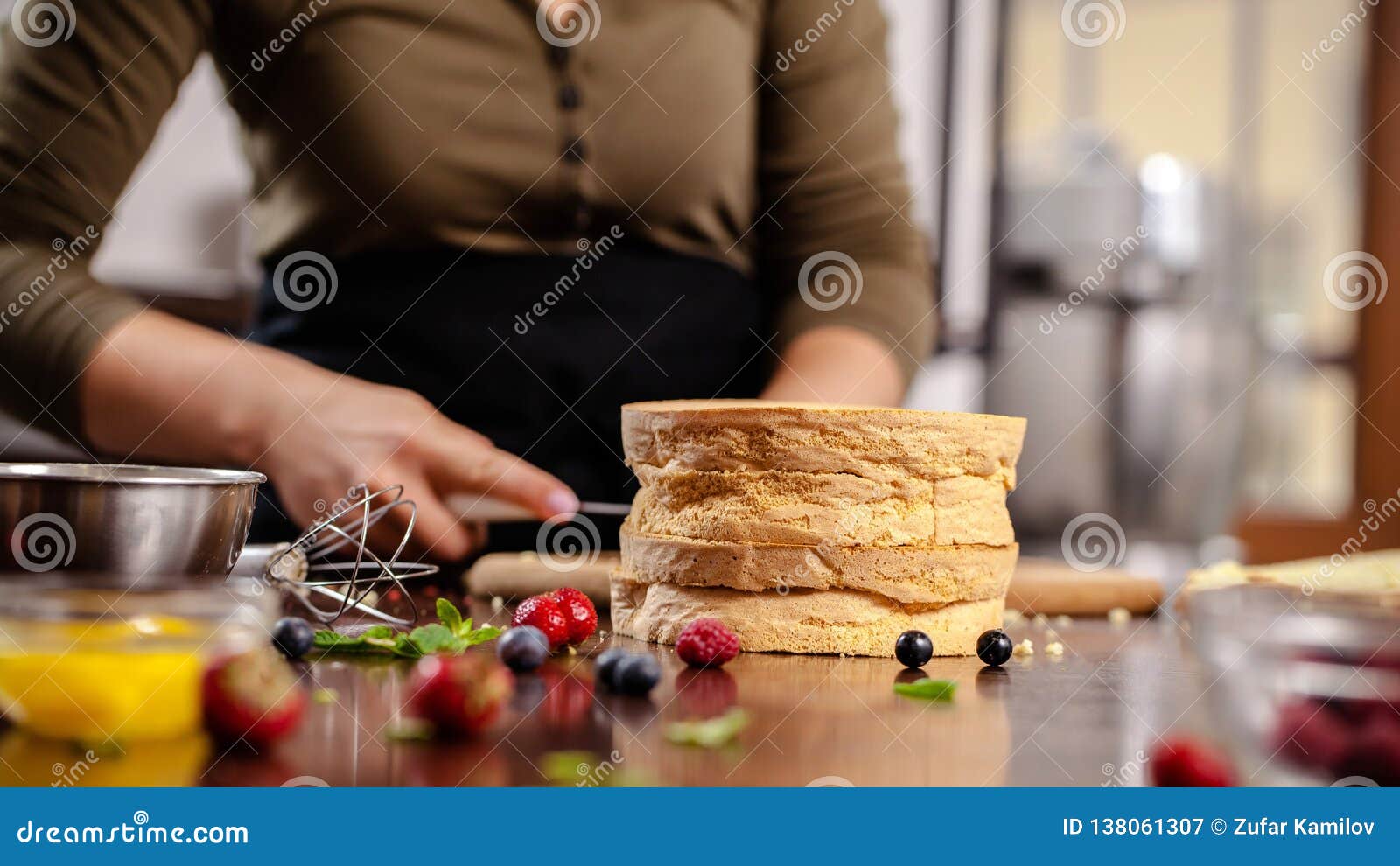 The Pastry Chef Prepares Biscuit Cake in the Home Kitchen or in a ...