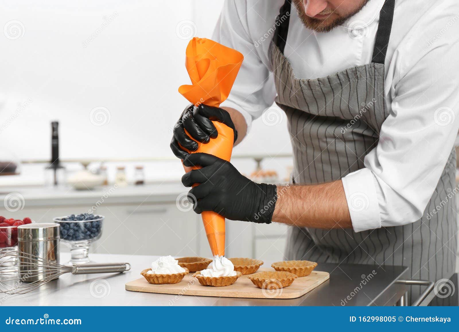 Pastry Chef Preparing Desserts at Table in Kitchen Stock Image - Image ...