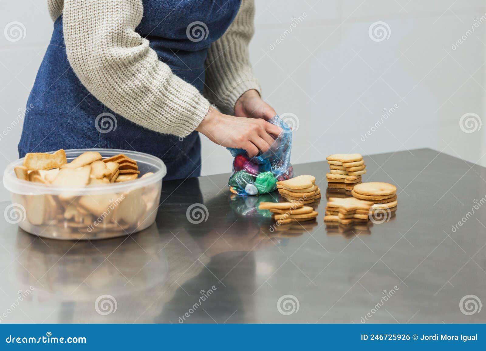 Pastry Chef Pulling Cookie Decorations Out of a Bag Stock Photo - Image ...