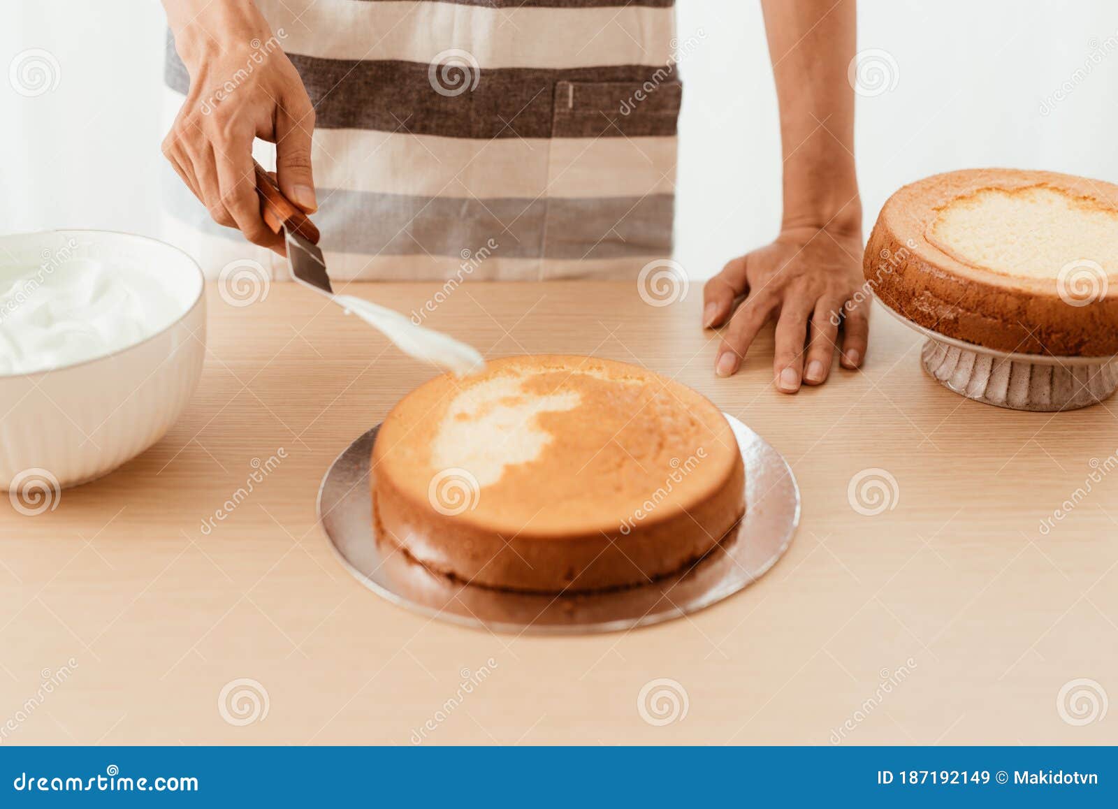 Pastry Chef Puts Cream on a Sponge Cake. Cake Making Process Stock ...