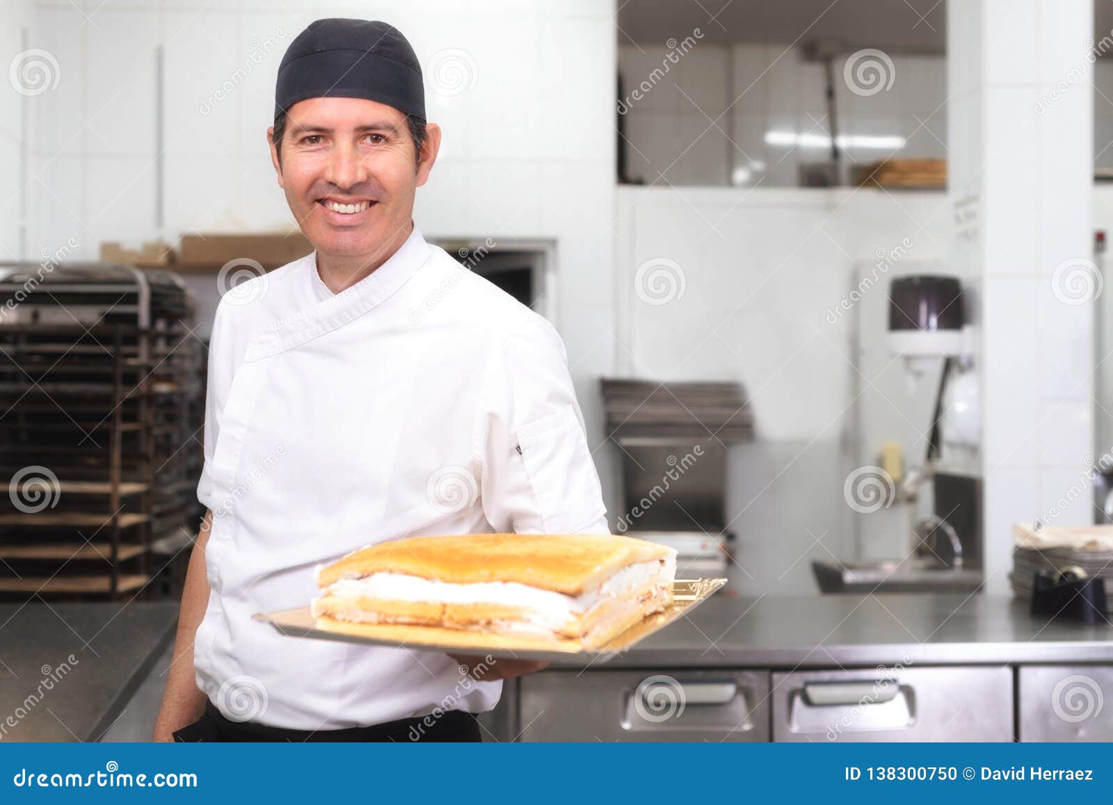 Pastry Chef Smiling with a Cake in His Hands at the Pastry Shop. Stock ...