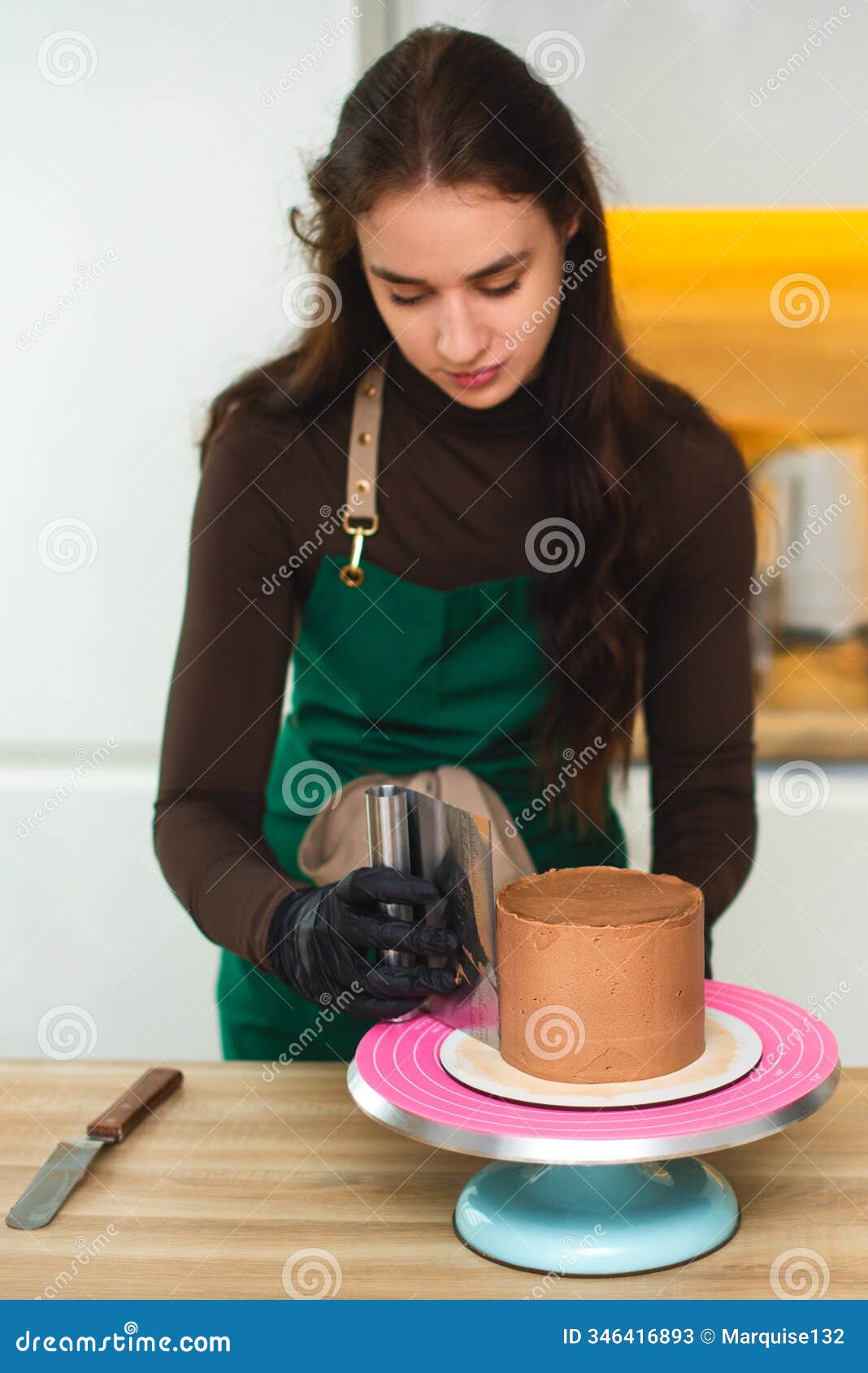 A Pastry Chef Smooths the Surface Smooths the Surface of a Chocolate ...