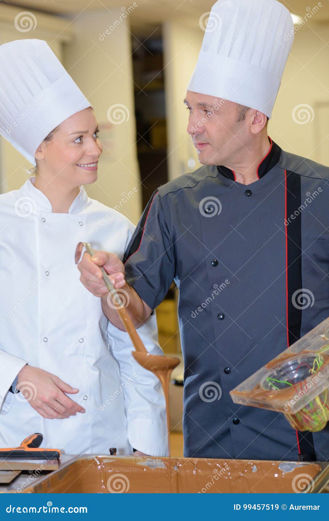 Pastry Chefs in Kitchen Decorating Cake Chocolate Stock Image - Image ...