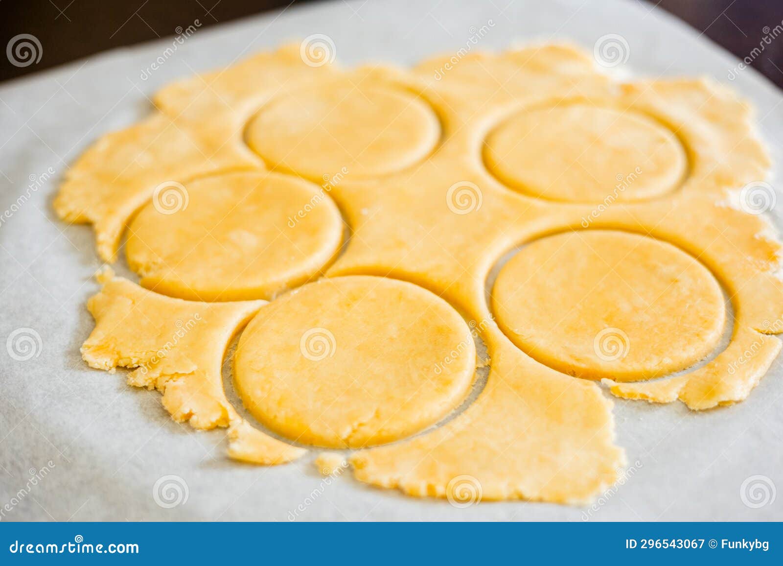 Close-up of Perfectly Cut Shortcrust Dough Circles in a Kitchen Setting ...