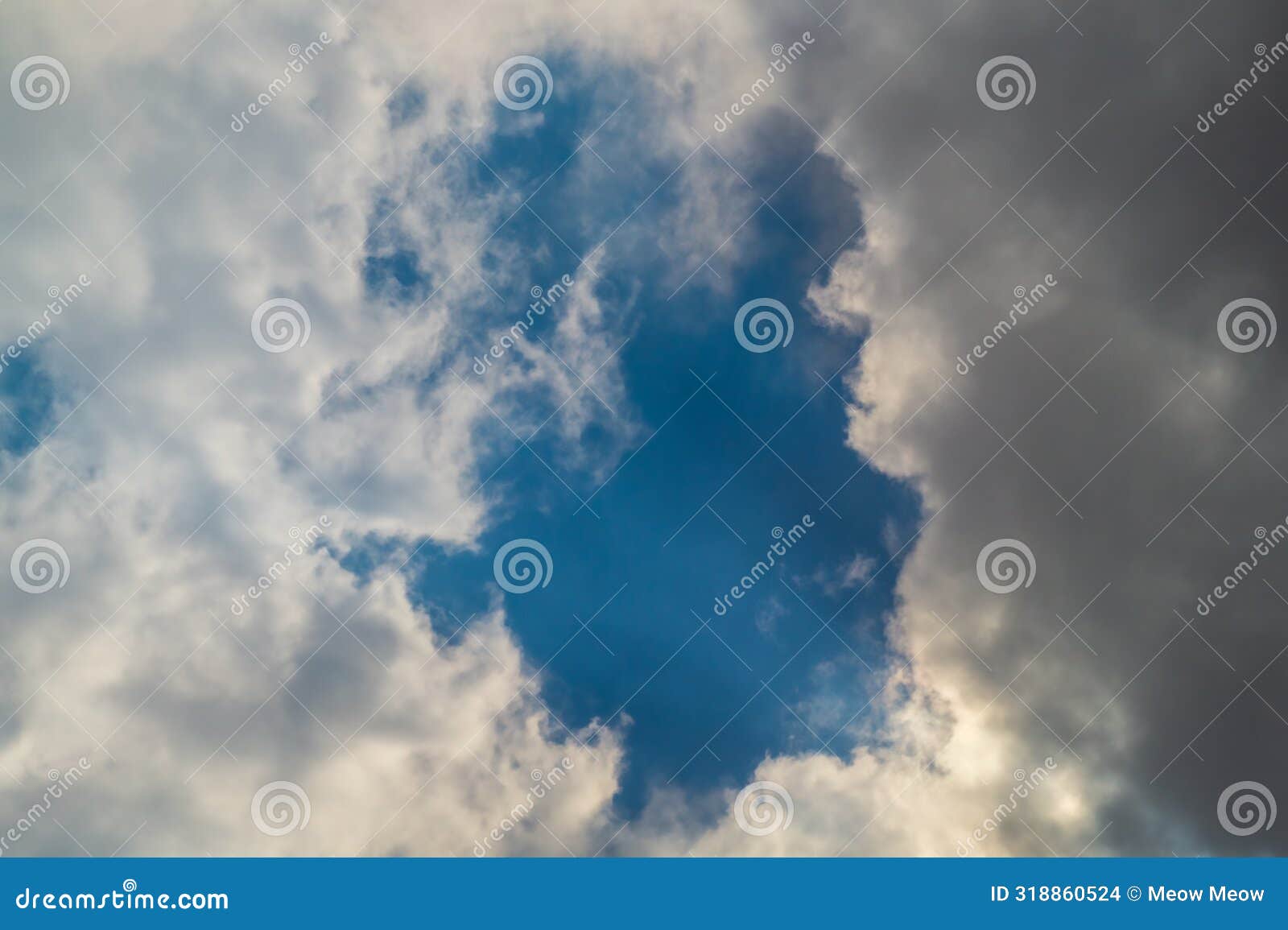 A Patch of Blue Sky Shining through the Diverging Rain Clouds. a Symbol ...