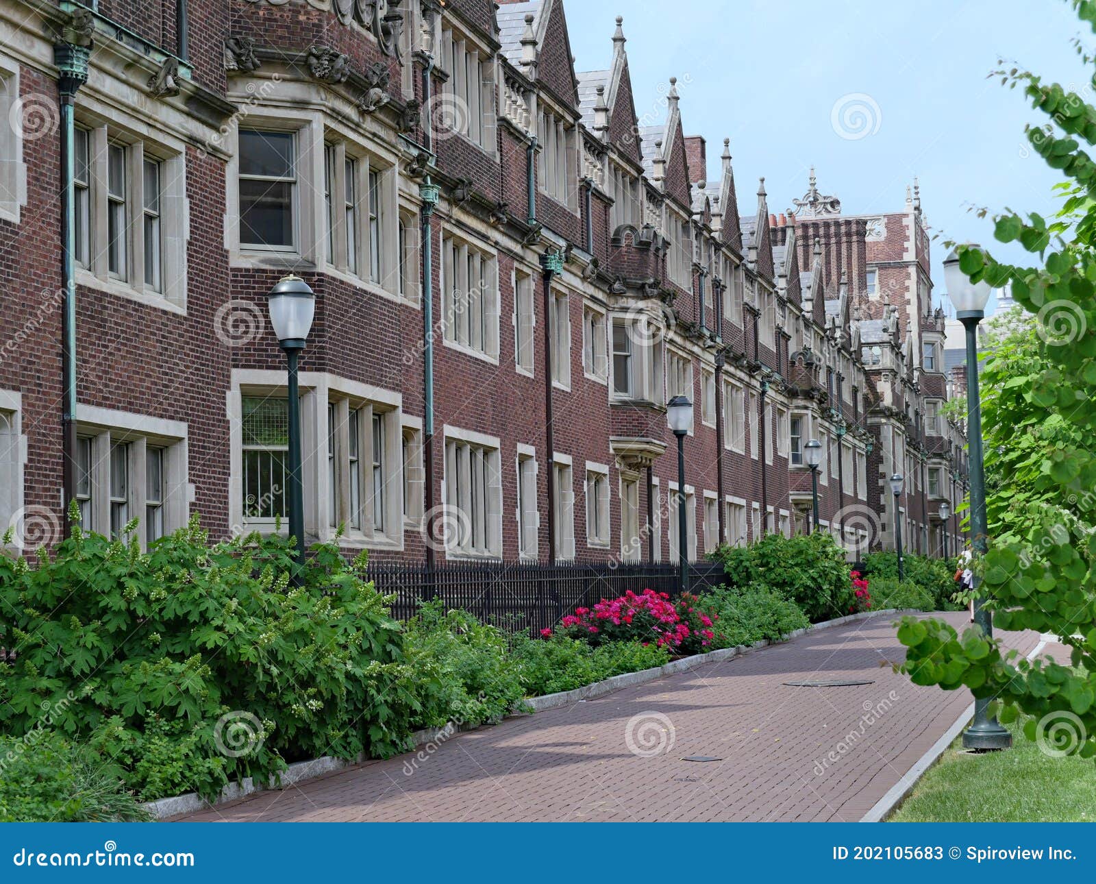 Path on the College Campus with beside a Gothic Style Brick Building ...