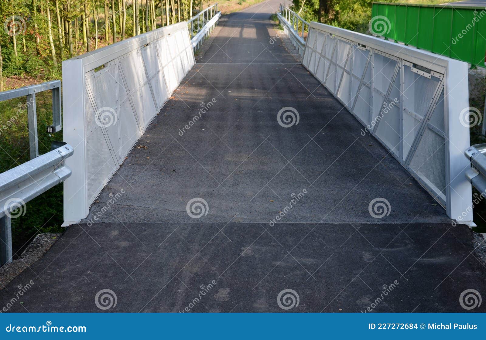 Path for Cyclists with an Asphalt Surface. Galvanized Iron Railing Over ...