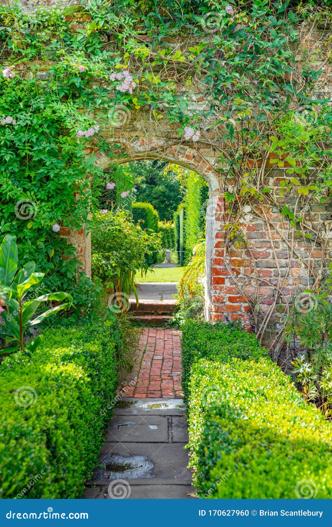 Path through Garden and Brick Arch Stock Photo - Image of archway ...