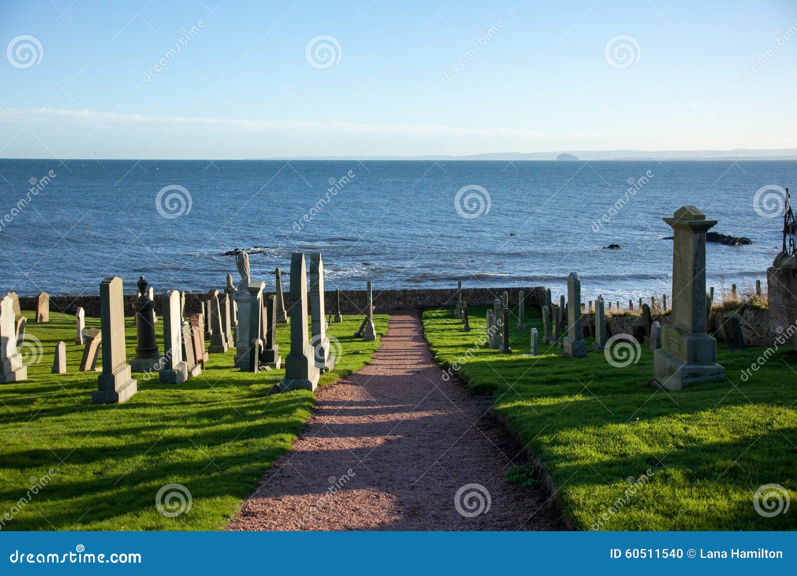 Path through the graveyard stock photo. Image of shadow - 60511540