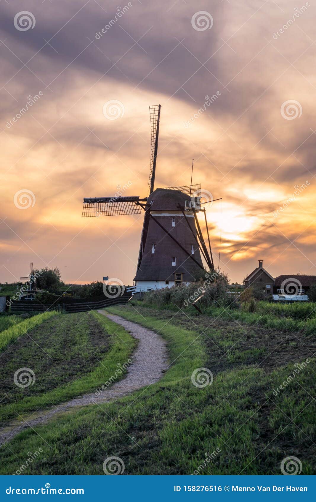 Path Leading To a Windmill at Sunset Stock Photo - Image of evening ...