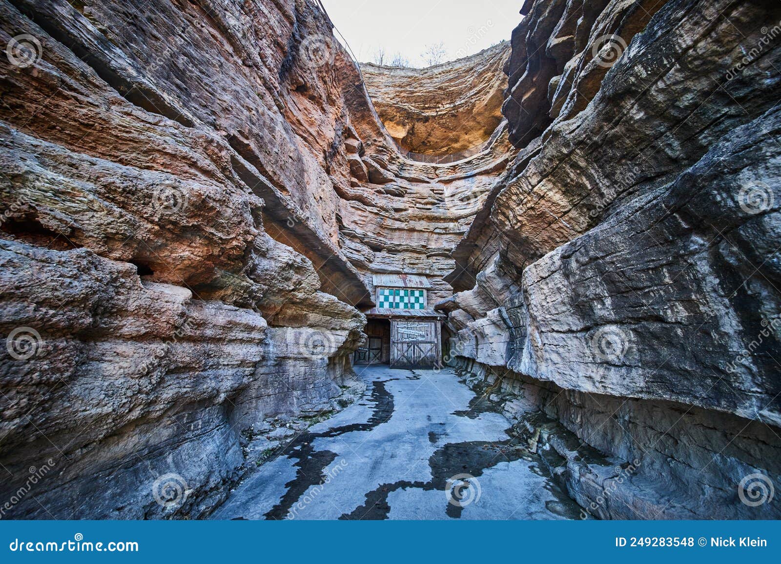 Path through Ominous Canyon Cliffs Leading into Cave Stock Photo ...
