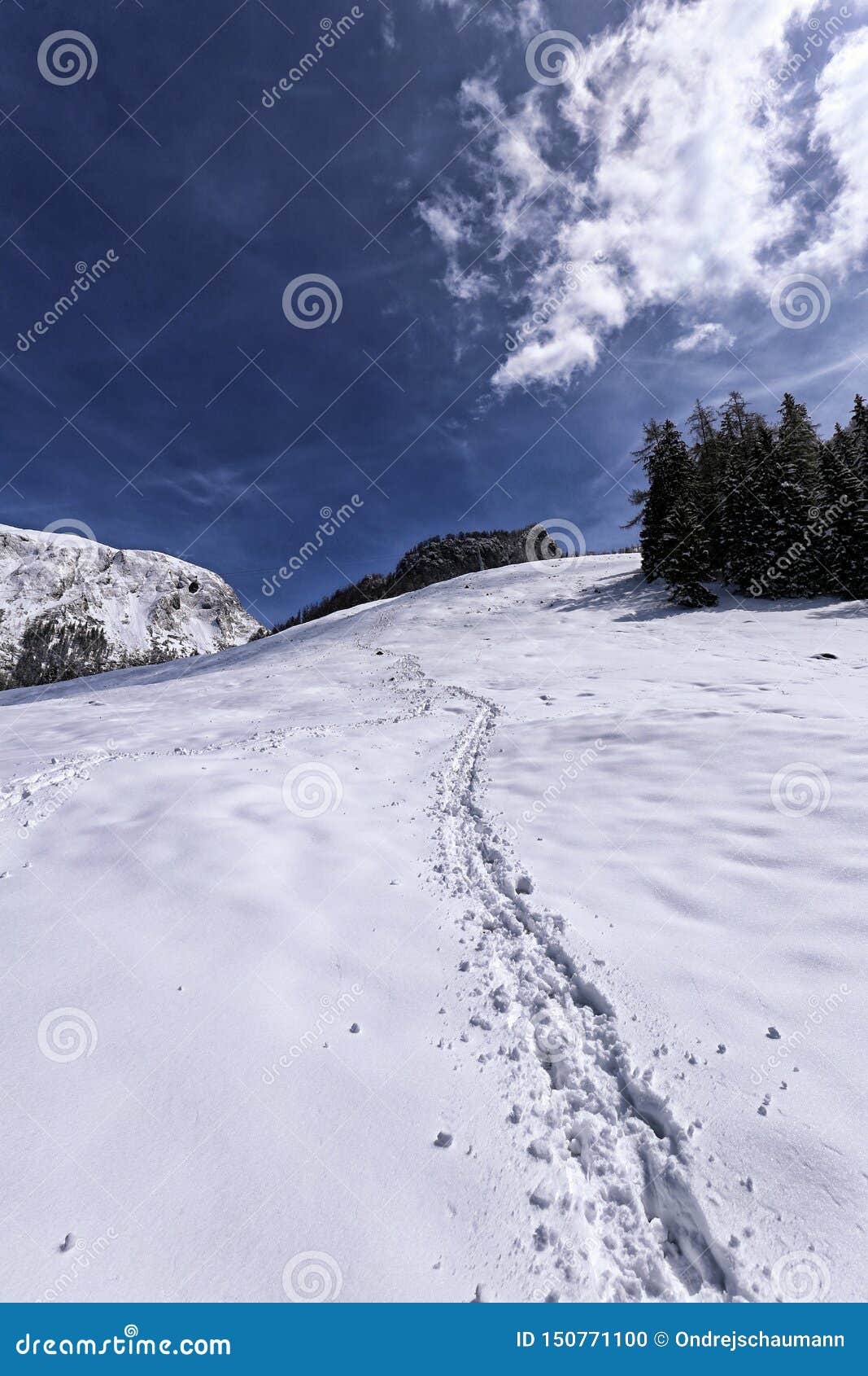 Path in the Snow Covered Steep Mountain Side Stock Photo - Image of ...