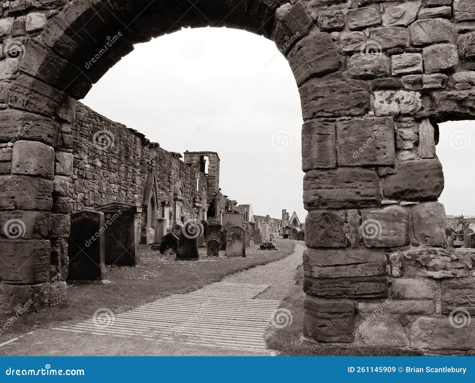 Path Under Stone Arch in Perimeter Wall of Graveyard Stock Image ...