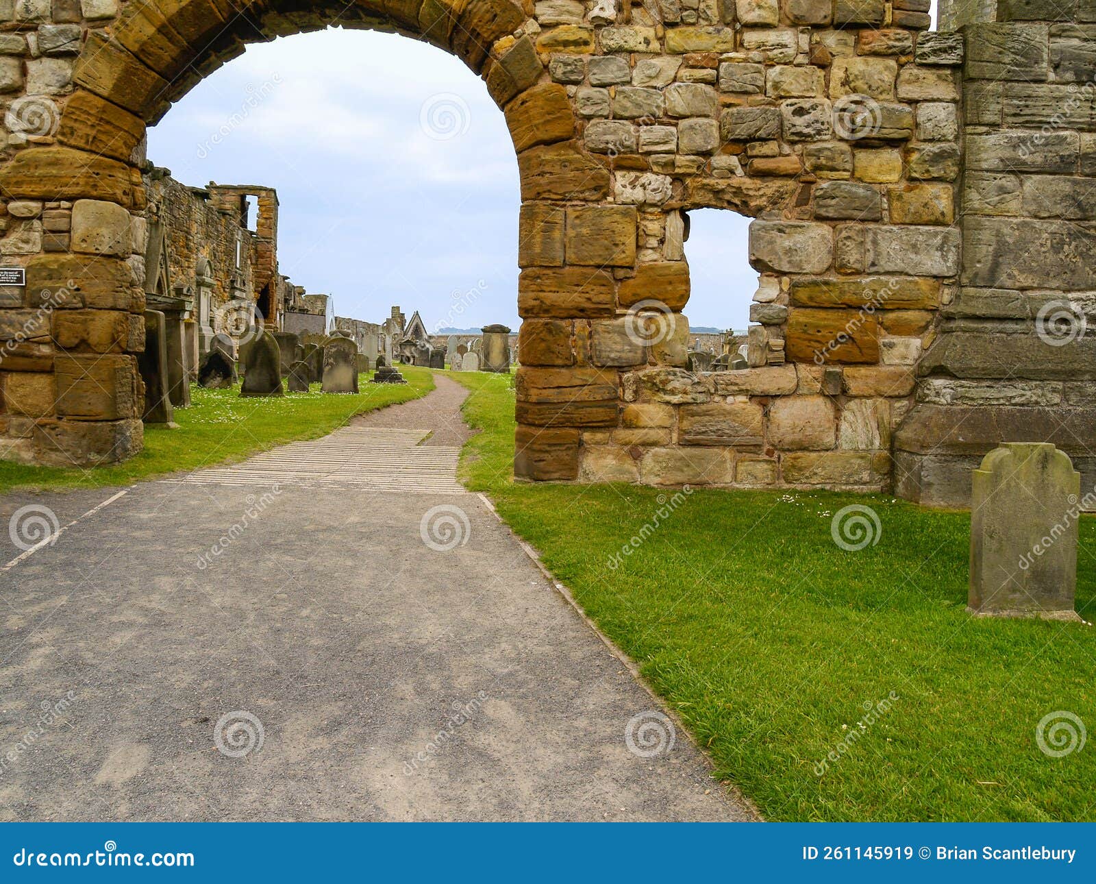 Path Under Stone Arch in Perimeter Wall of Graveyard Stock Image ...
