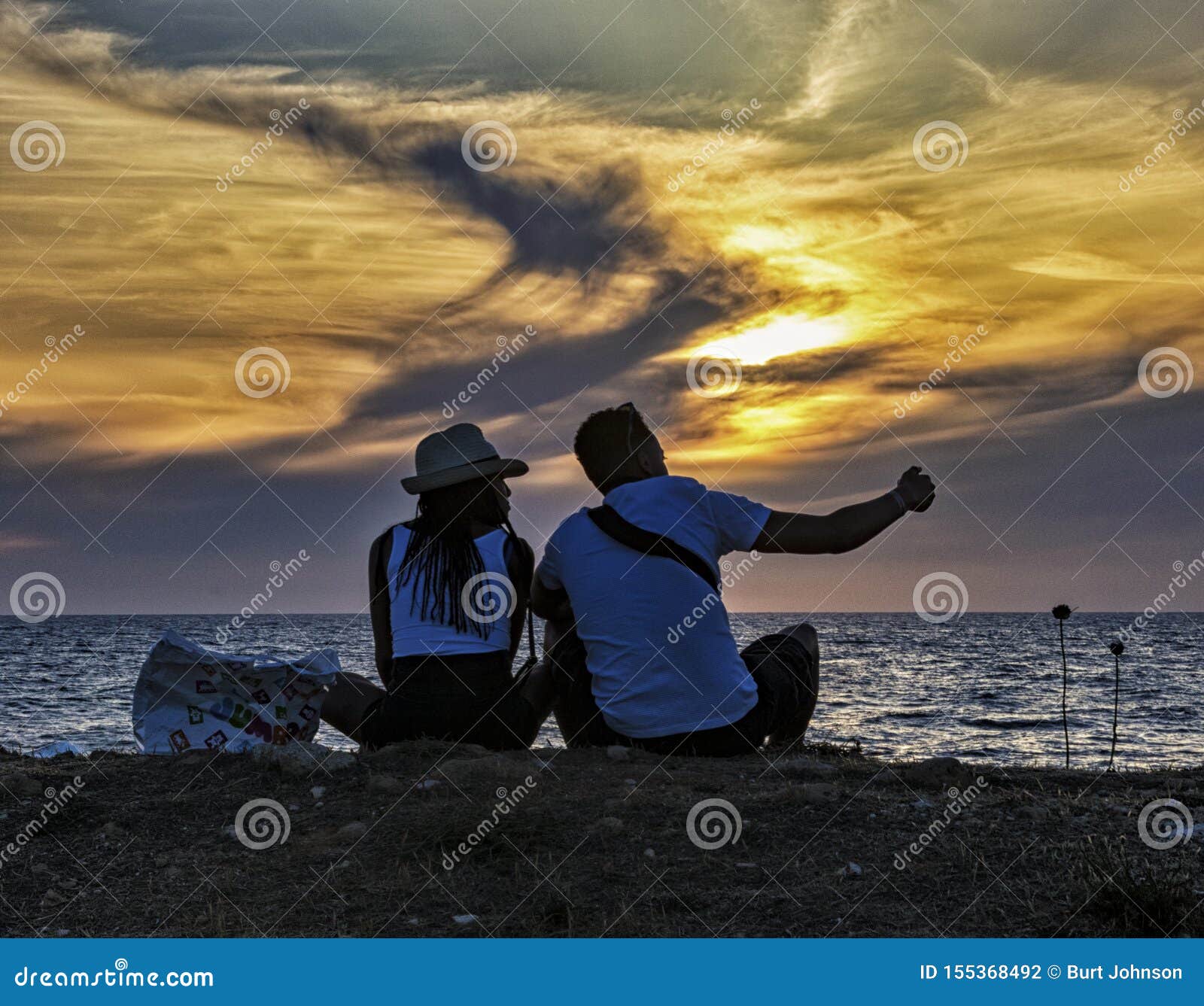 Pathos, Cyprus - May 19, 2016 - Young Couple Sits on Beach and Enjoys a ...
