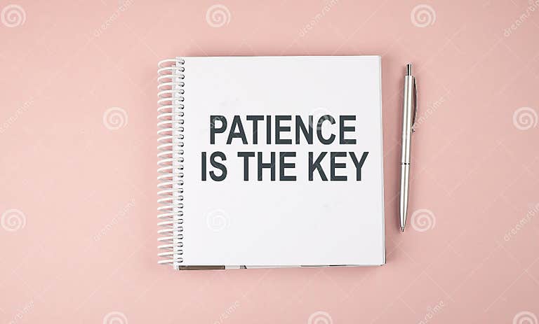 PATIENCE is the KEY Text on Notebook with Pen on the Pink Background ...
