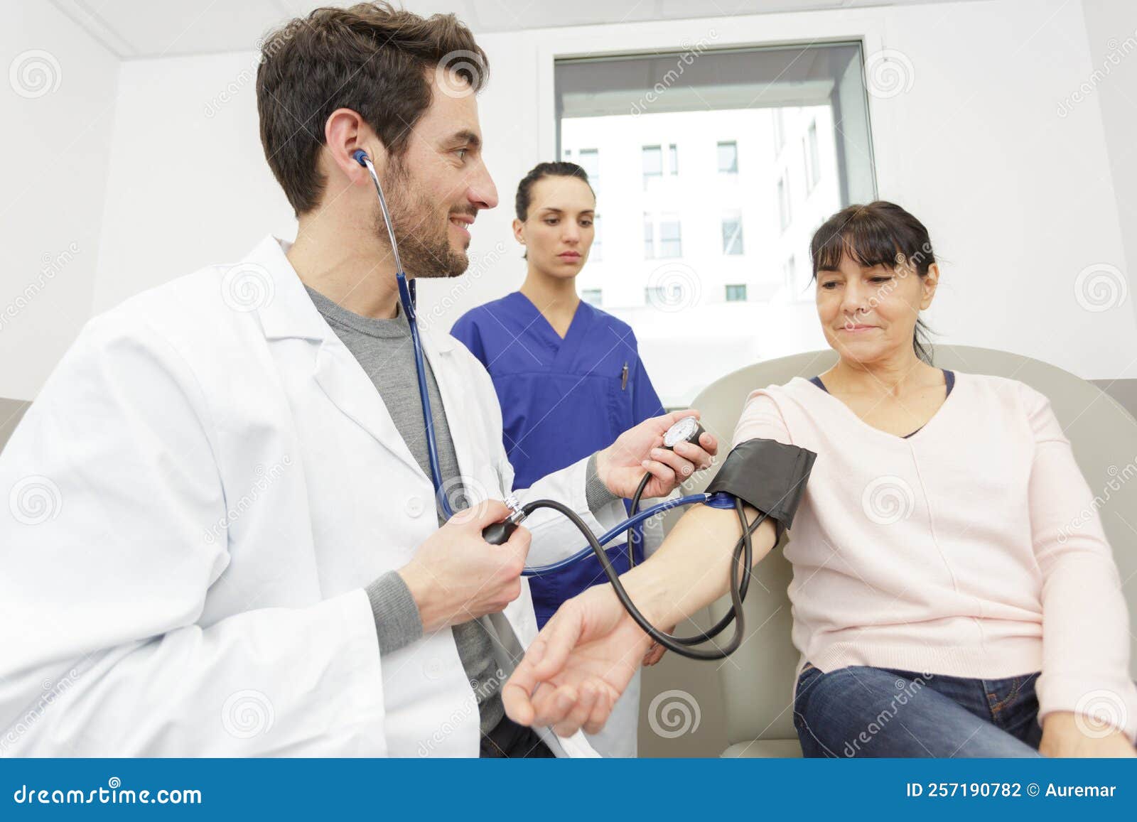 Patient Being Checked in Doctors Office Stock Photo - Image of sixties ...