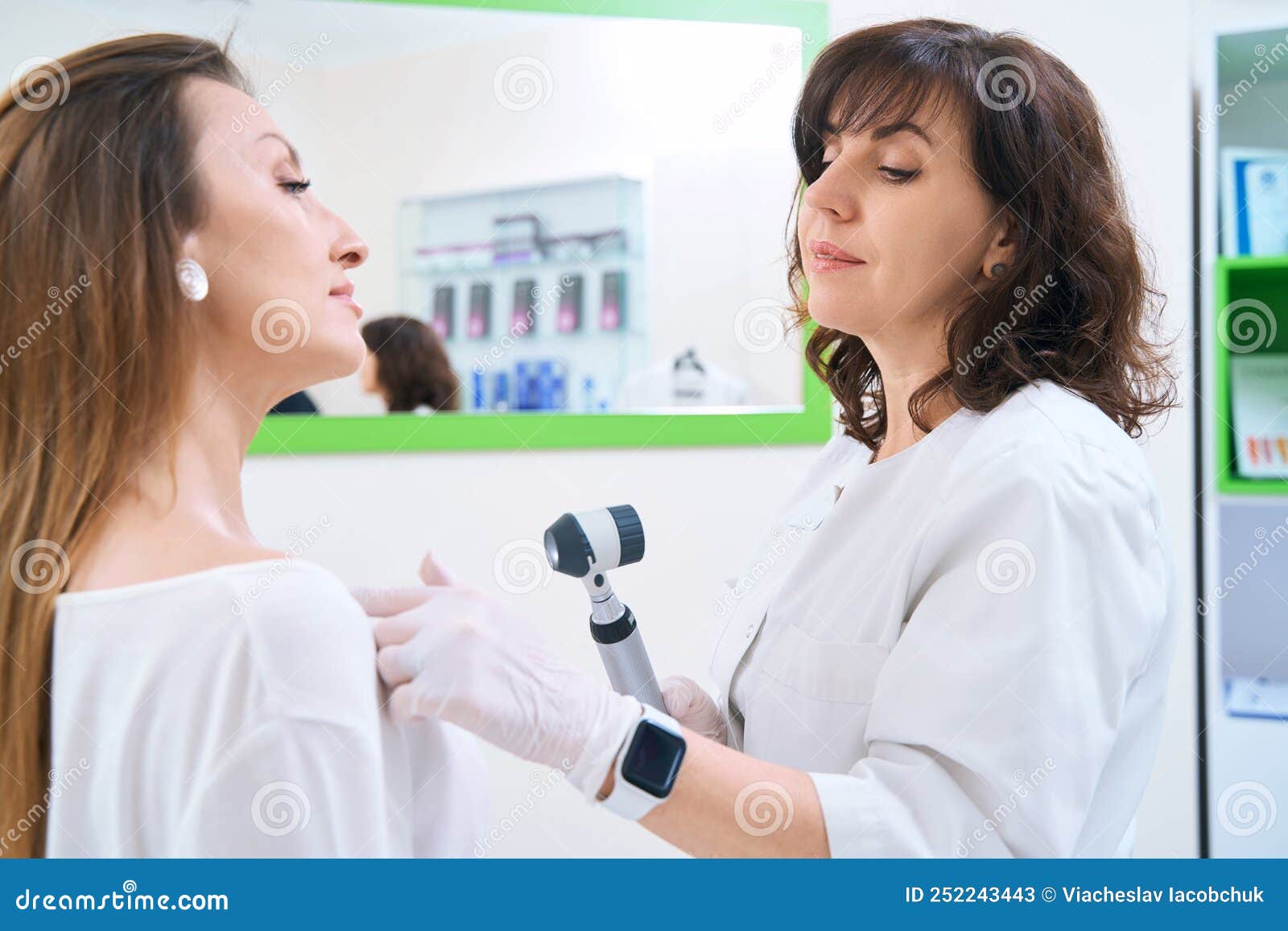 Doctor Diagnoses Neoplasms in the Decollete Area with a Dermatoscope ...