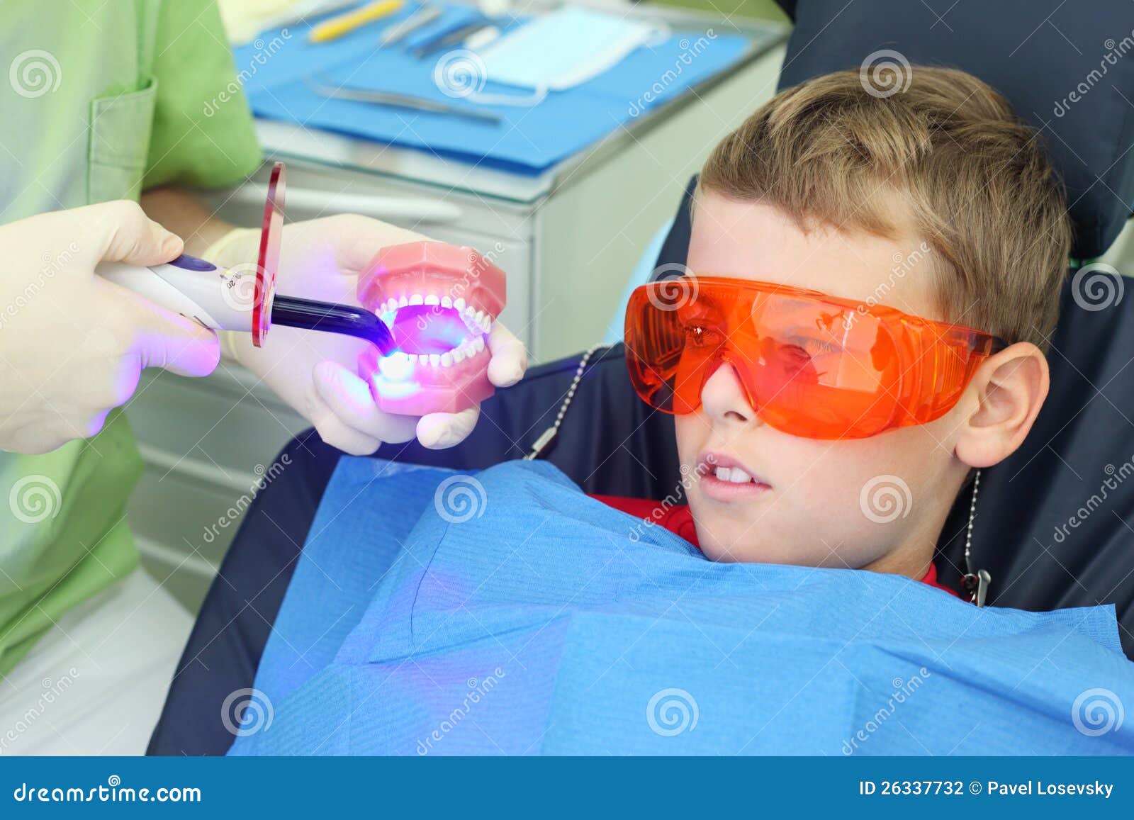Patient Boy Looks At Light Tool Stock Photo | CartoonDealer.com #26337732