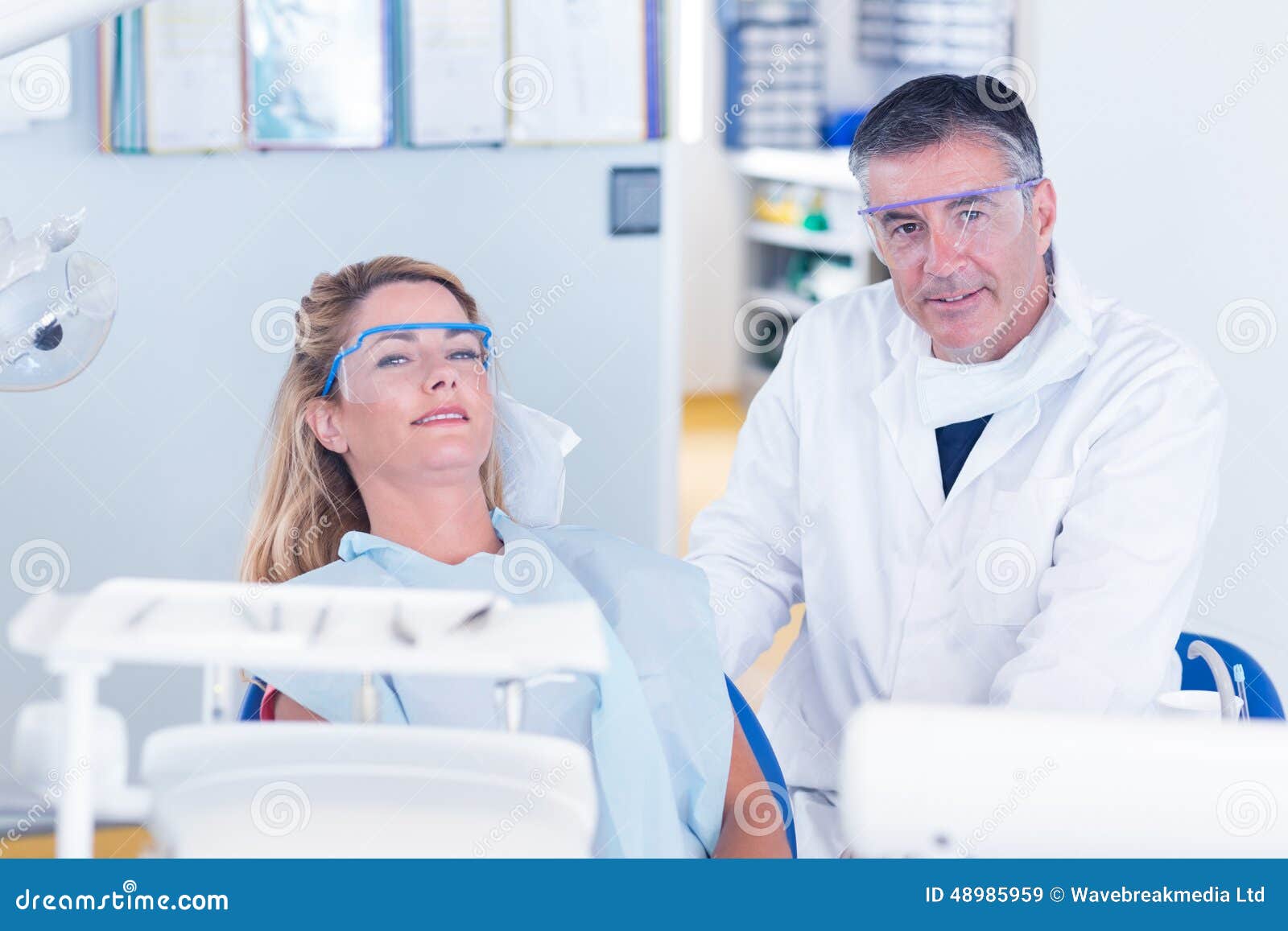 Patient and Dentist Smiling at Camera Stock Image - Image of dentists ...