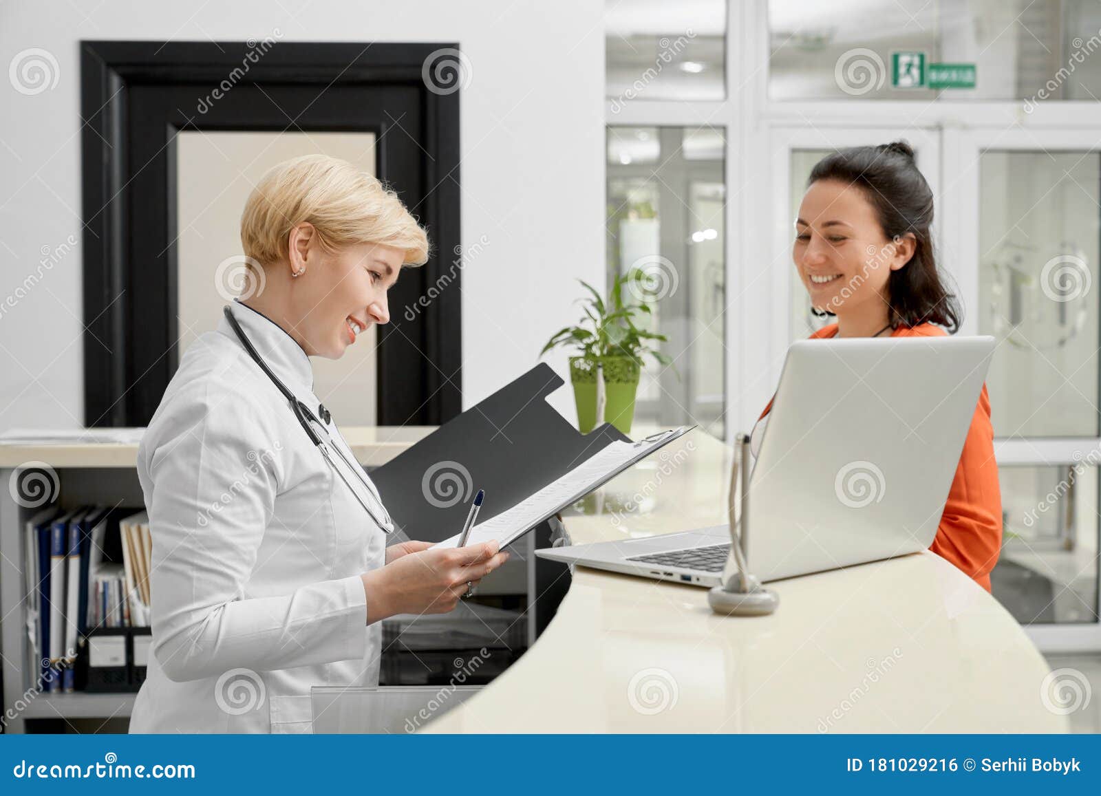 Patient and Doctor with Folder on Reception. Stock Photo - Image of ...