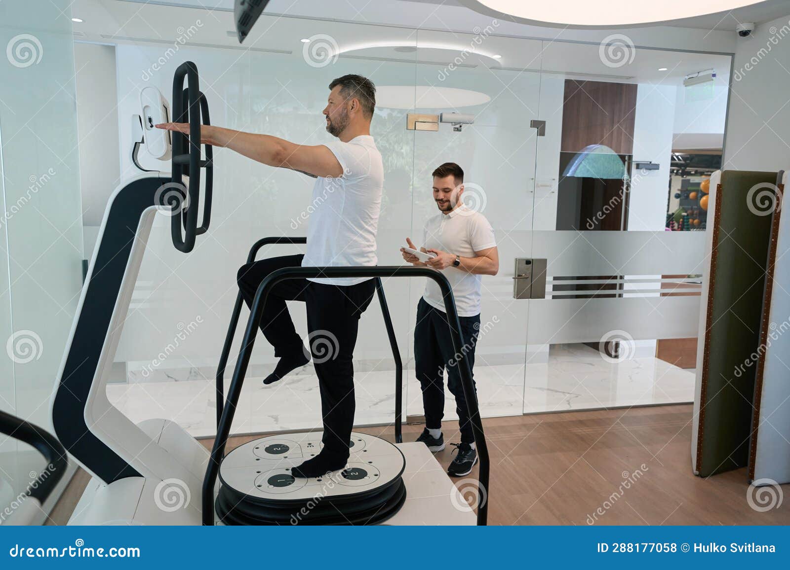 Man Performing Balance Exercise with Equipment in Presence of ...