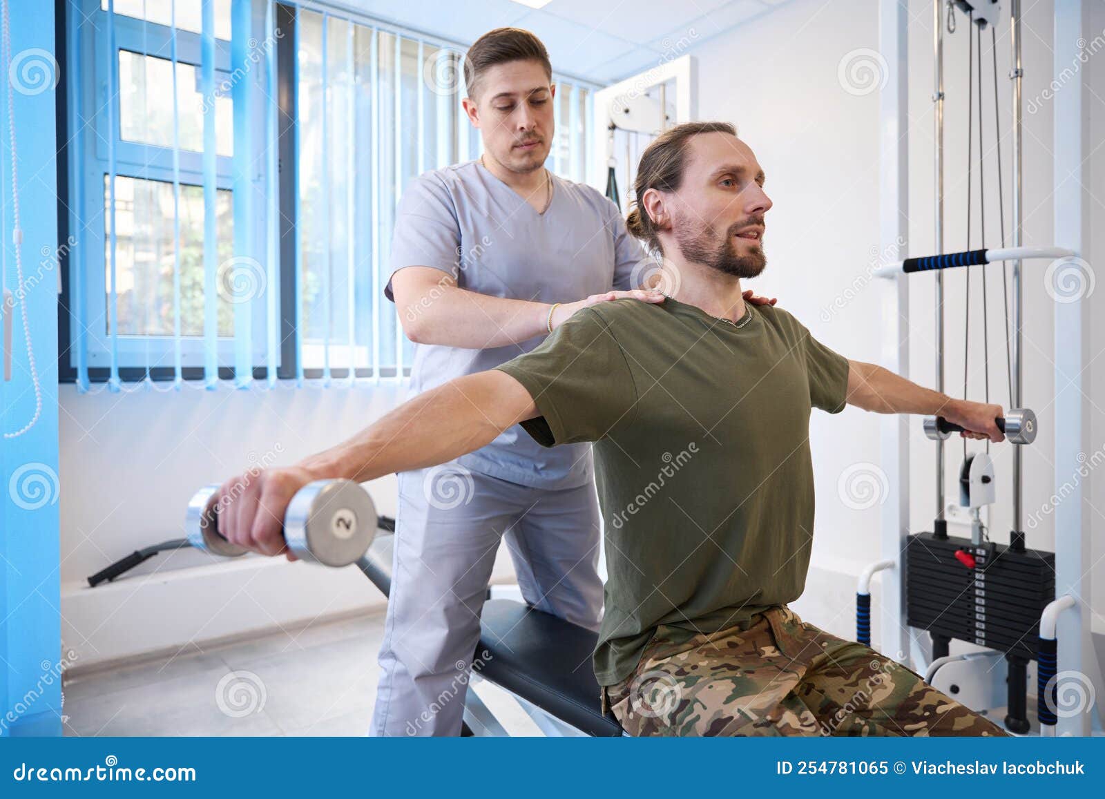 Patient Doing Special Exercises with Dumbbells Under Supervision of ...