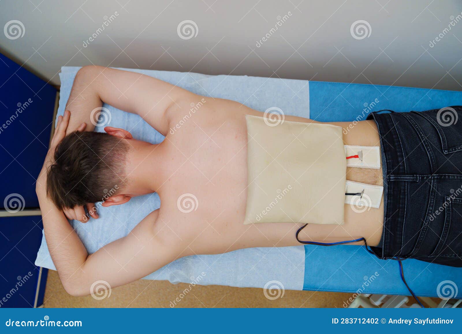 Patient with an Electrotherapy on the Back, Electrical Stimulation ...