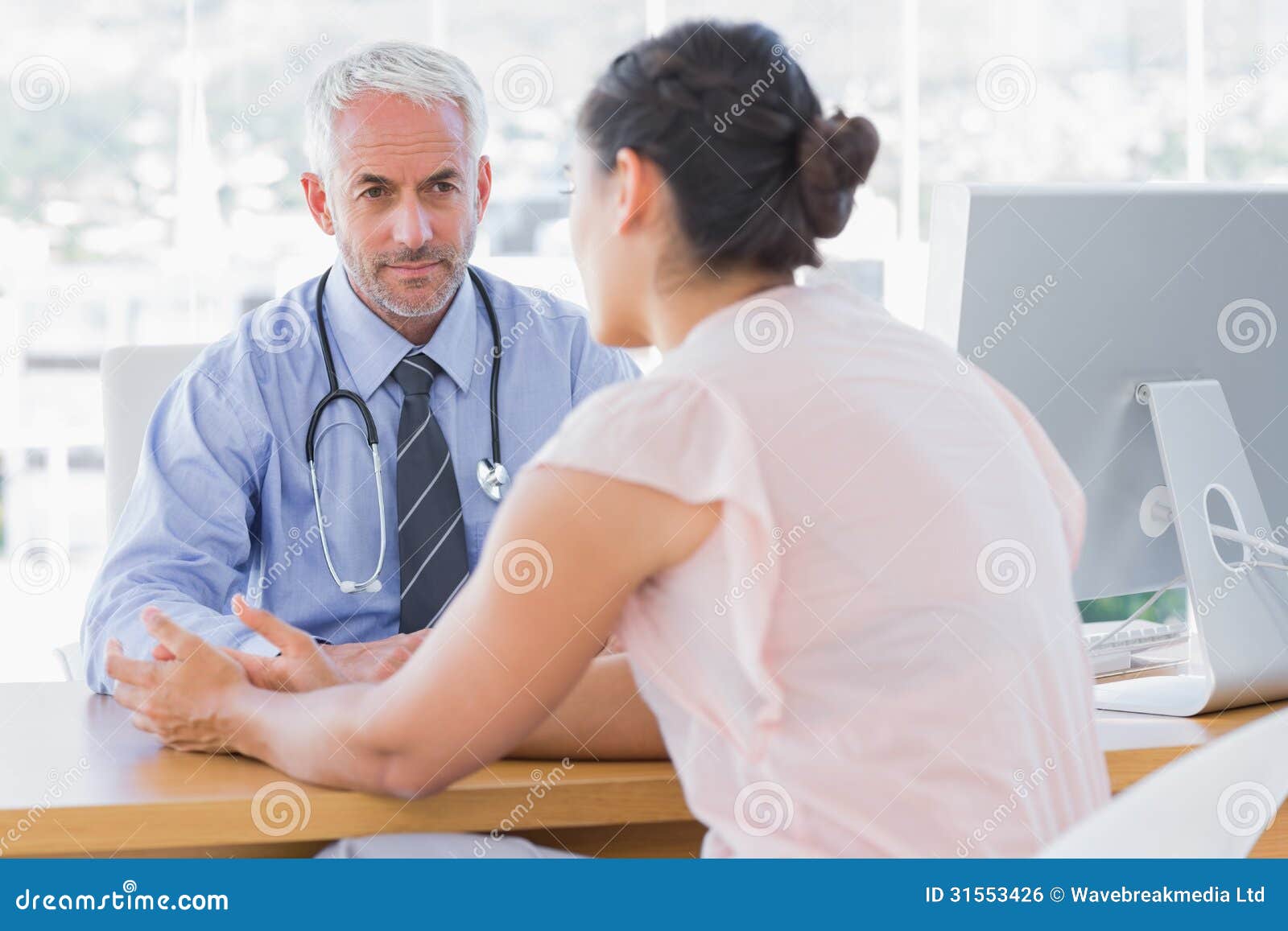 Patient Explaining Her Painful To Doctor Stock Photo - Image of clinic ...