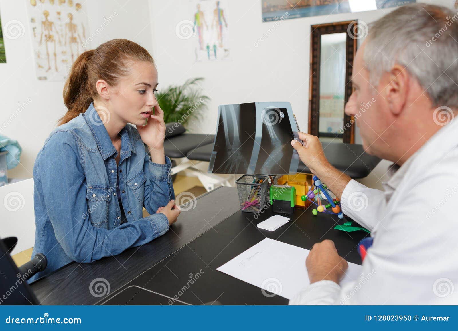 Patient Explaining Neck Problems To Doctor Stock Photo - Image of ...