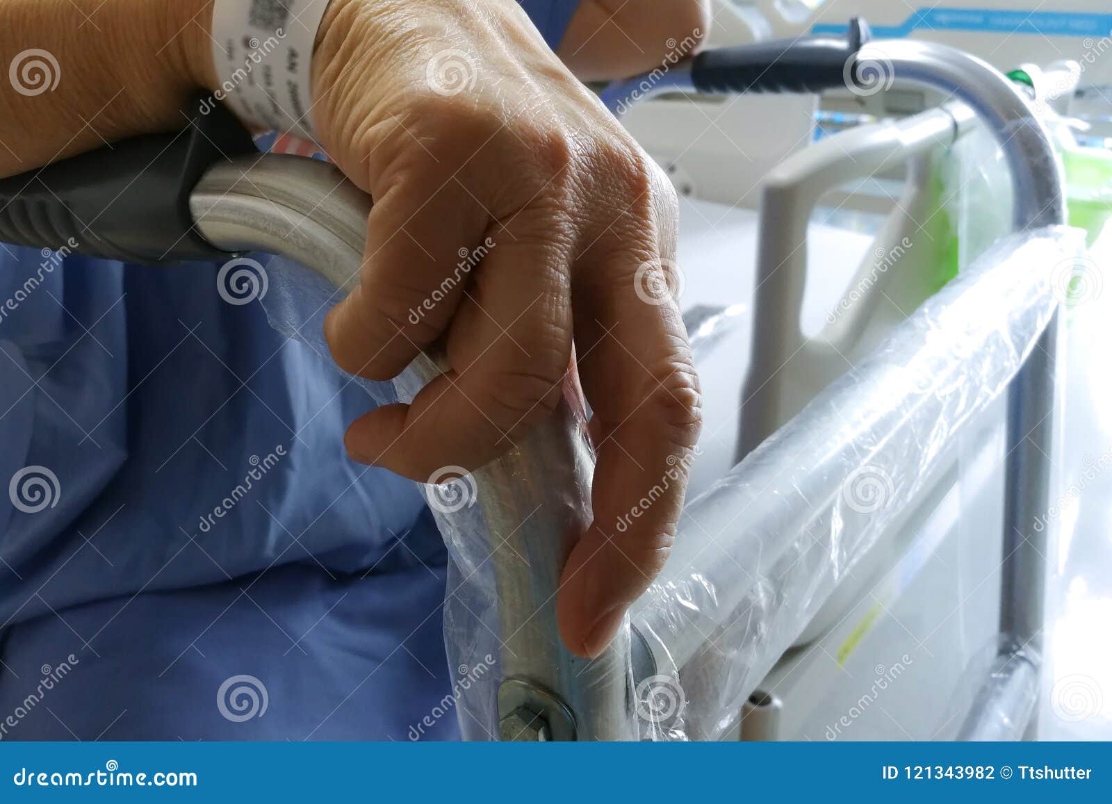 Patient hand on a walker. stock photo. Image of medical - 121343982