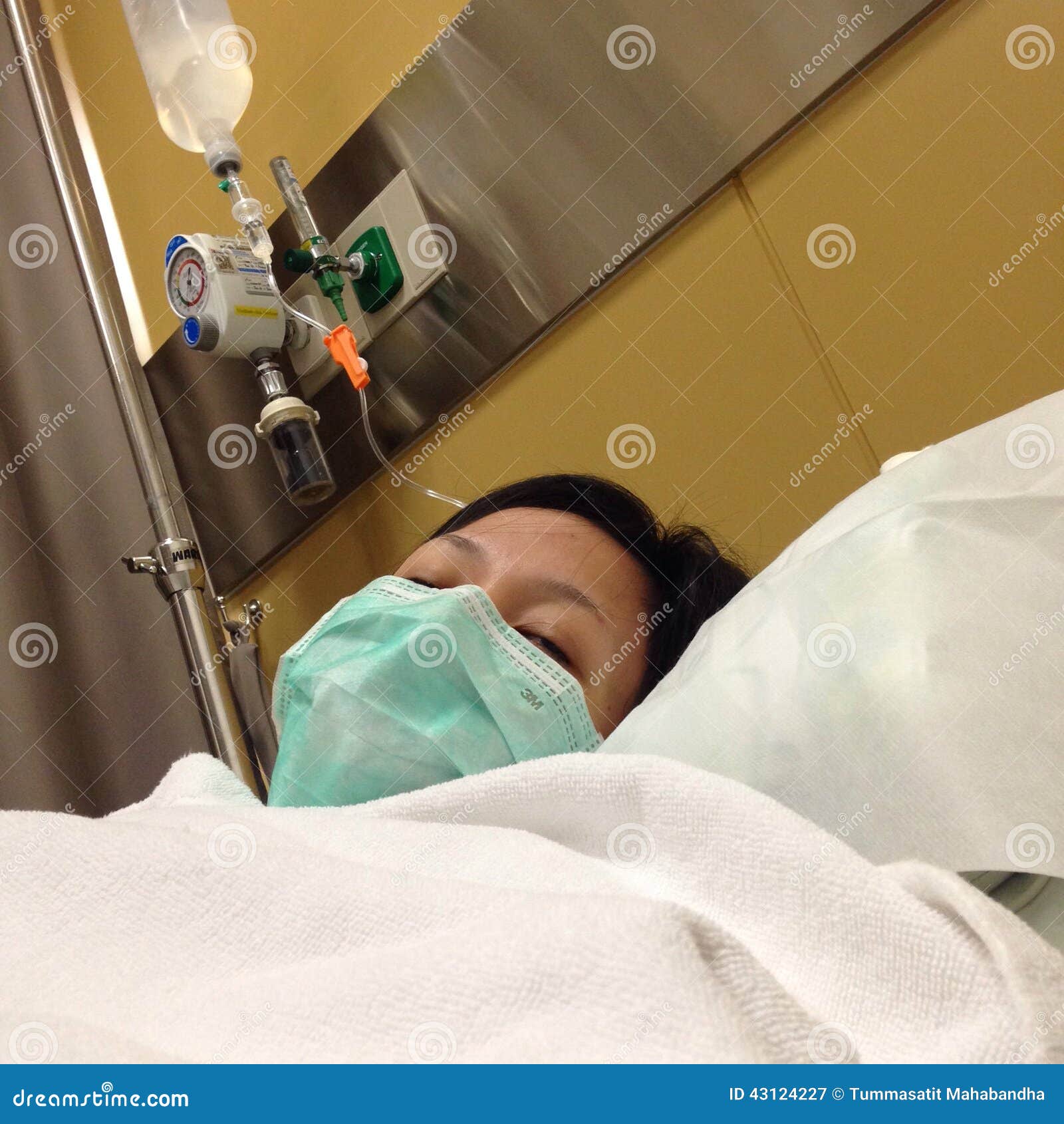 Patient In Hospital Bed Icu