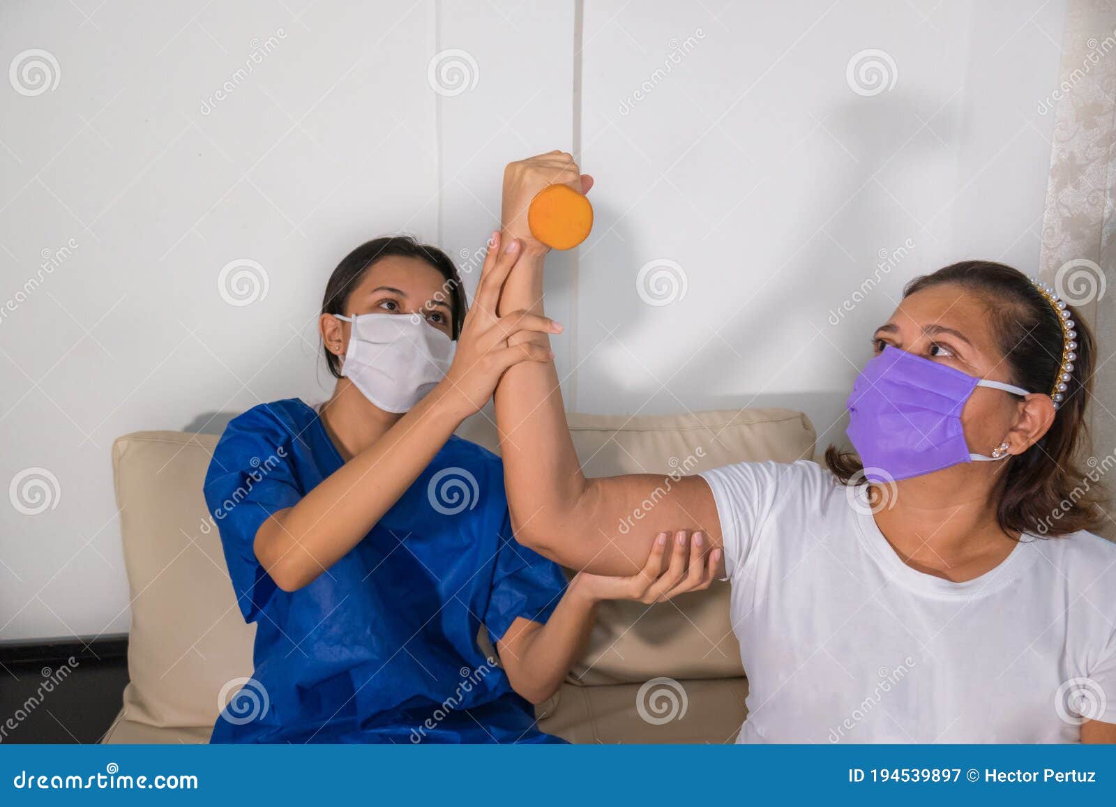 Patient with Mask at the Physiotherapy Doing Physical Therapy Exercises ...