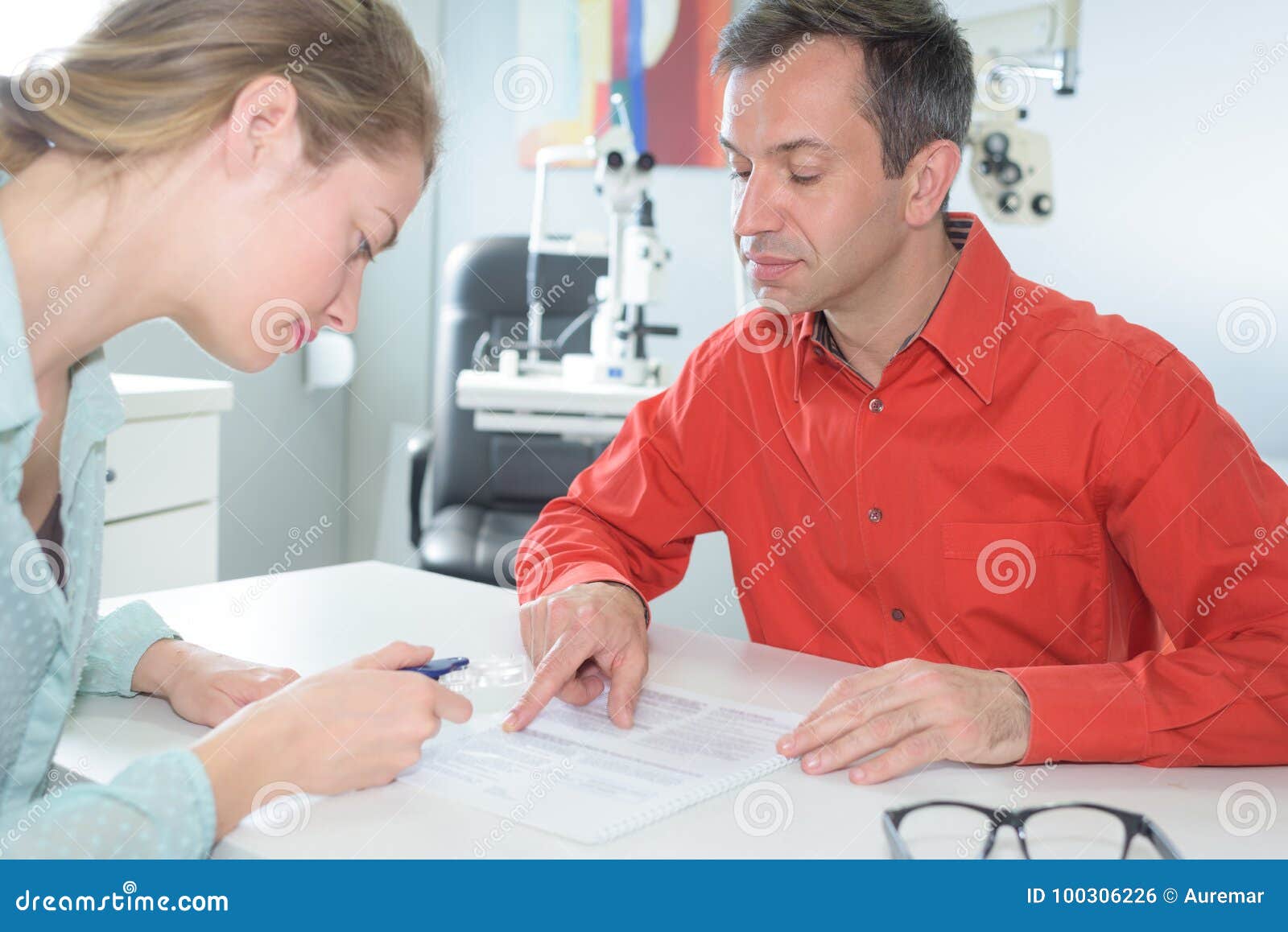 Patient pointing at form stock photo. Image of profession - 100306226