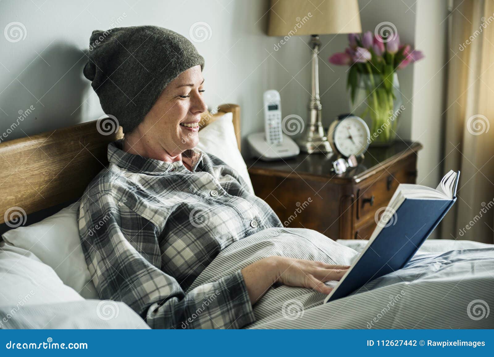 Patient Reading Book in Bed Stock Photo - Image of cheerful, book ...