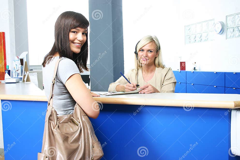 Patient & receptionist stock image. Image of smile - 18147295
