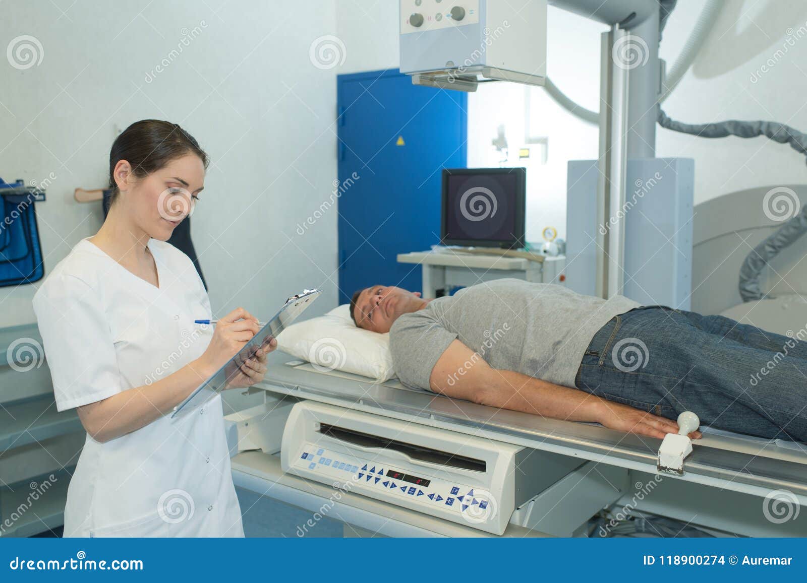 Patient on Scanner Bed Nurse Making Notes Stock Photo - Image of ...