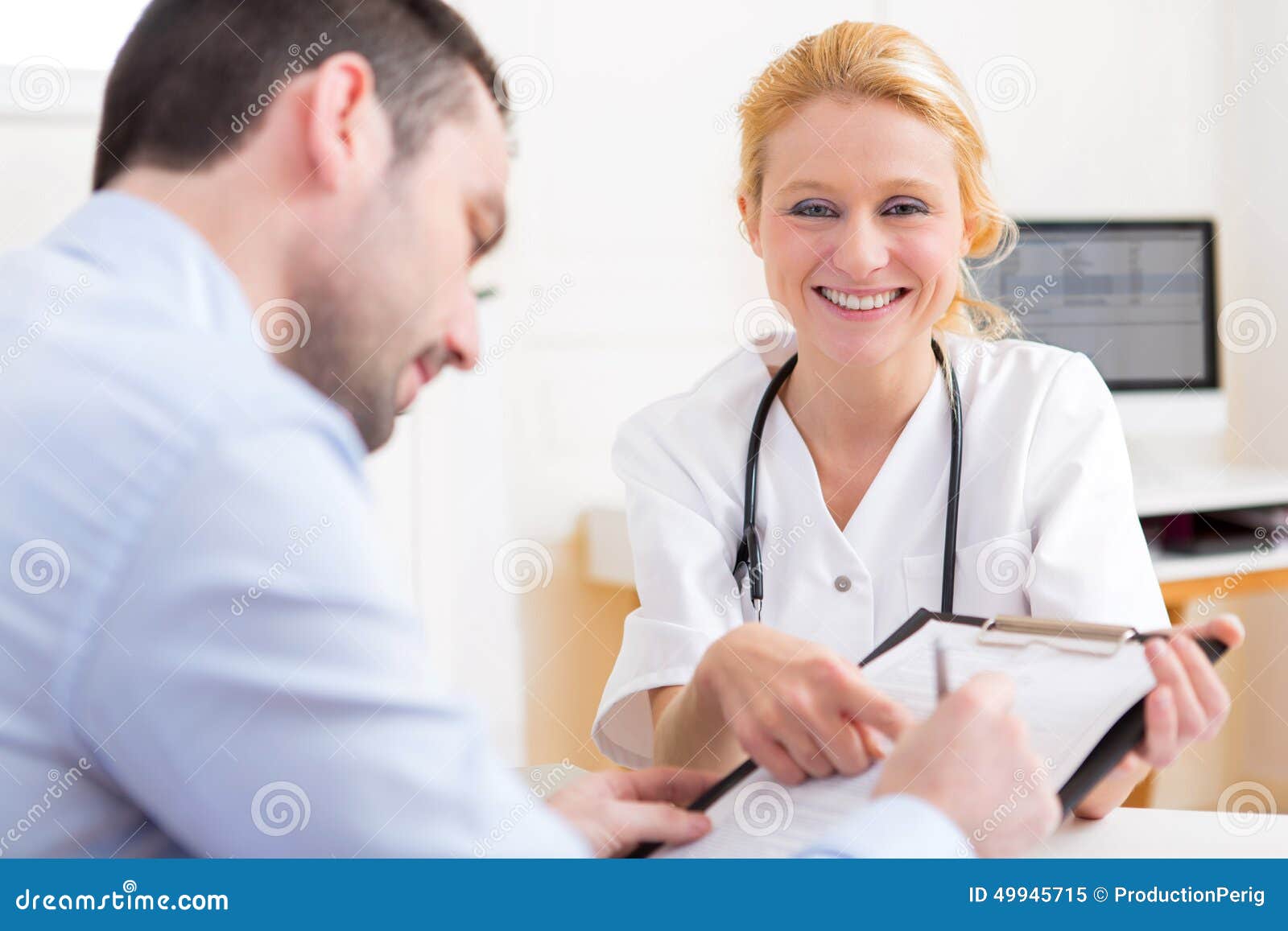 Patient Signing the Document of a Young Attractive Doctor Stock Image ...