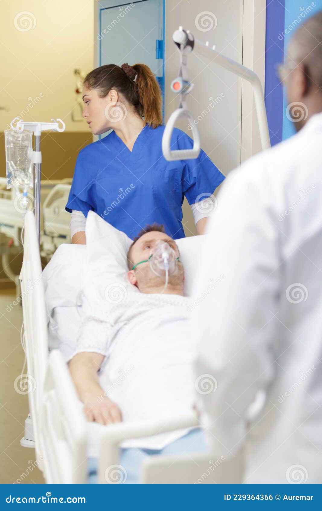 Patient on Stretcher Being Pushed by Nurse Stock Photo - Image of ...