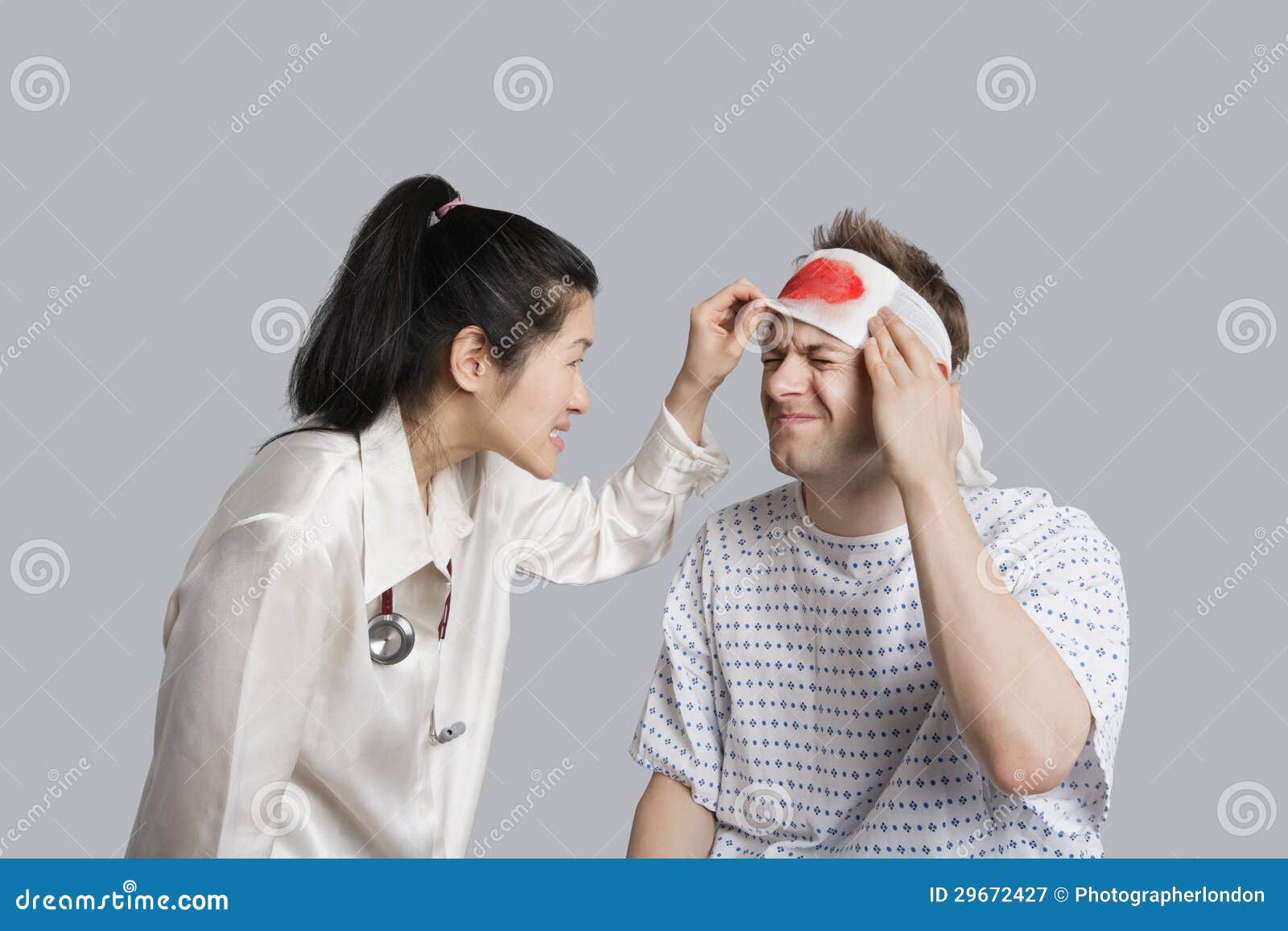 Patient Suffering from Pain while Doctor Examining Him Stock Image ...