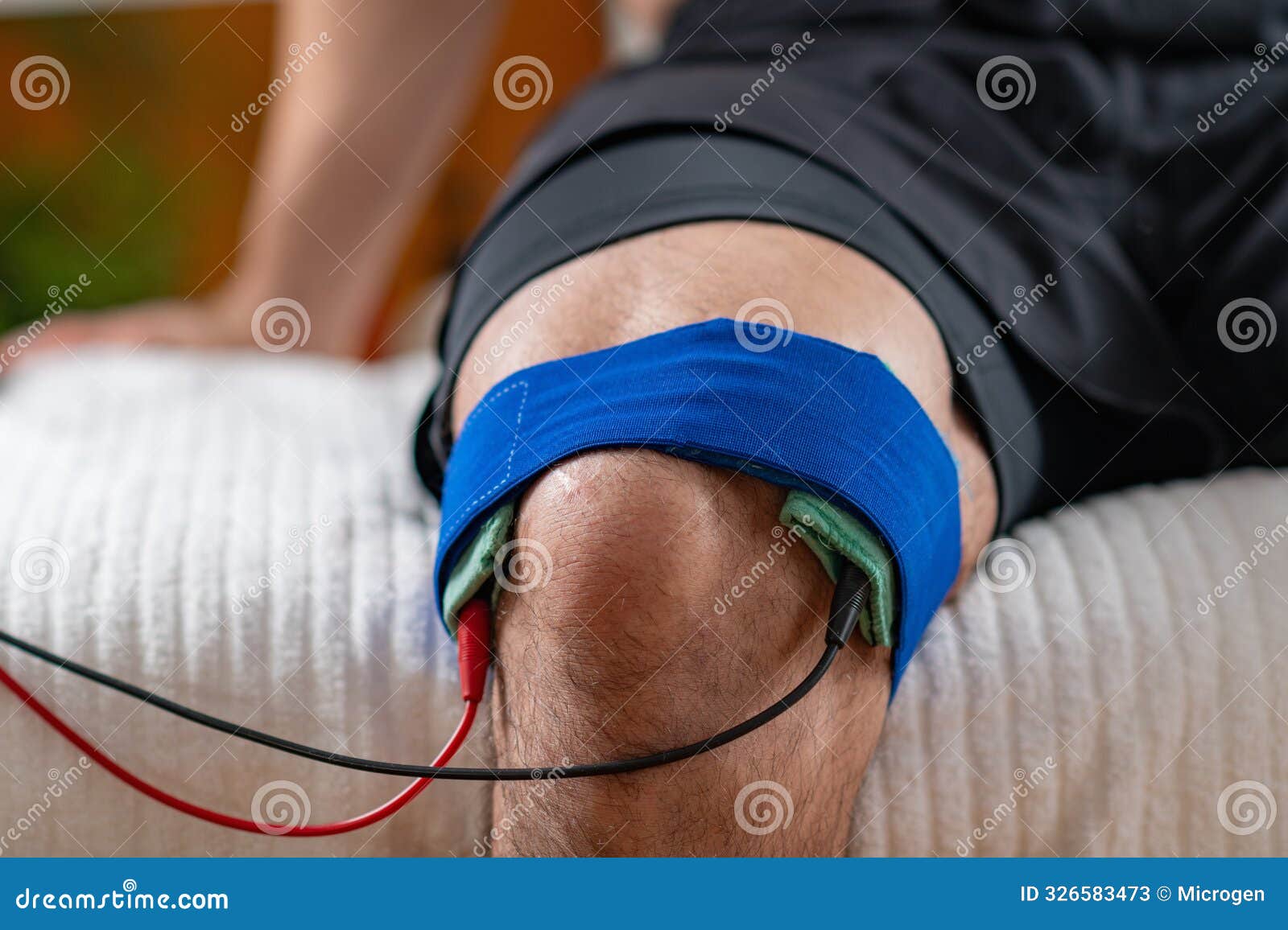 A Patient Undergoing Knee Therapy with Electrotherapy Treatment for ...