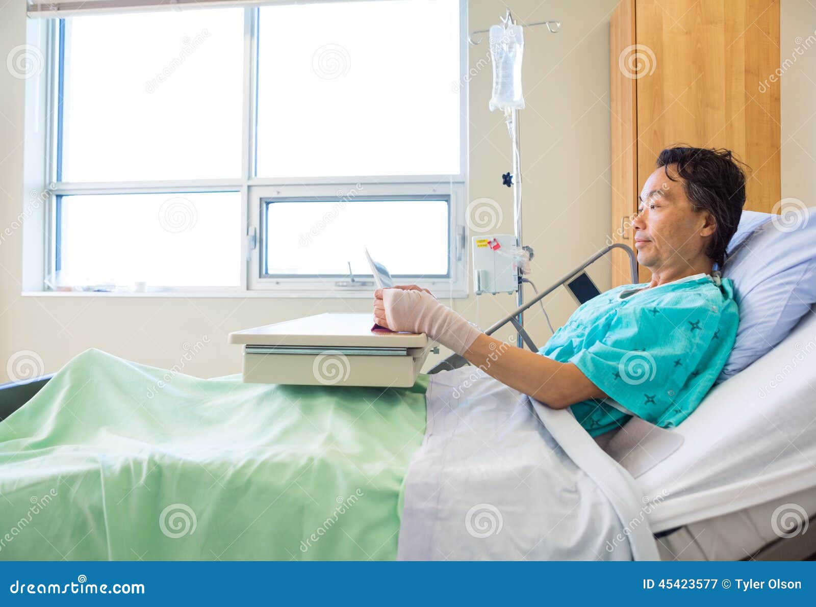 Patient Using Digital Tablet on Hospital Bed Stock Image - Image of ...