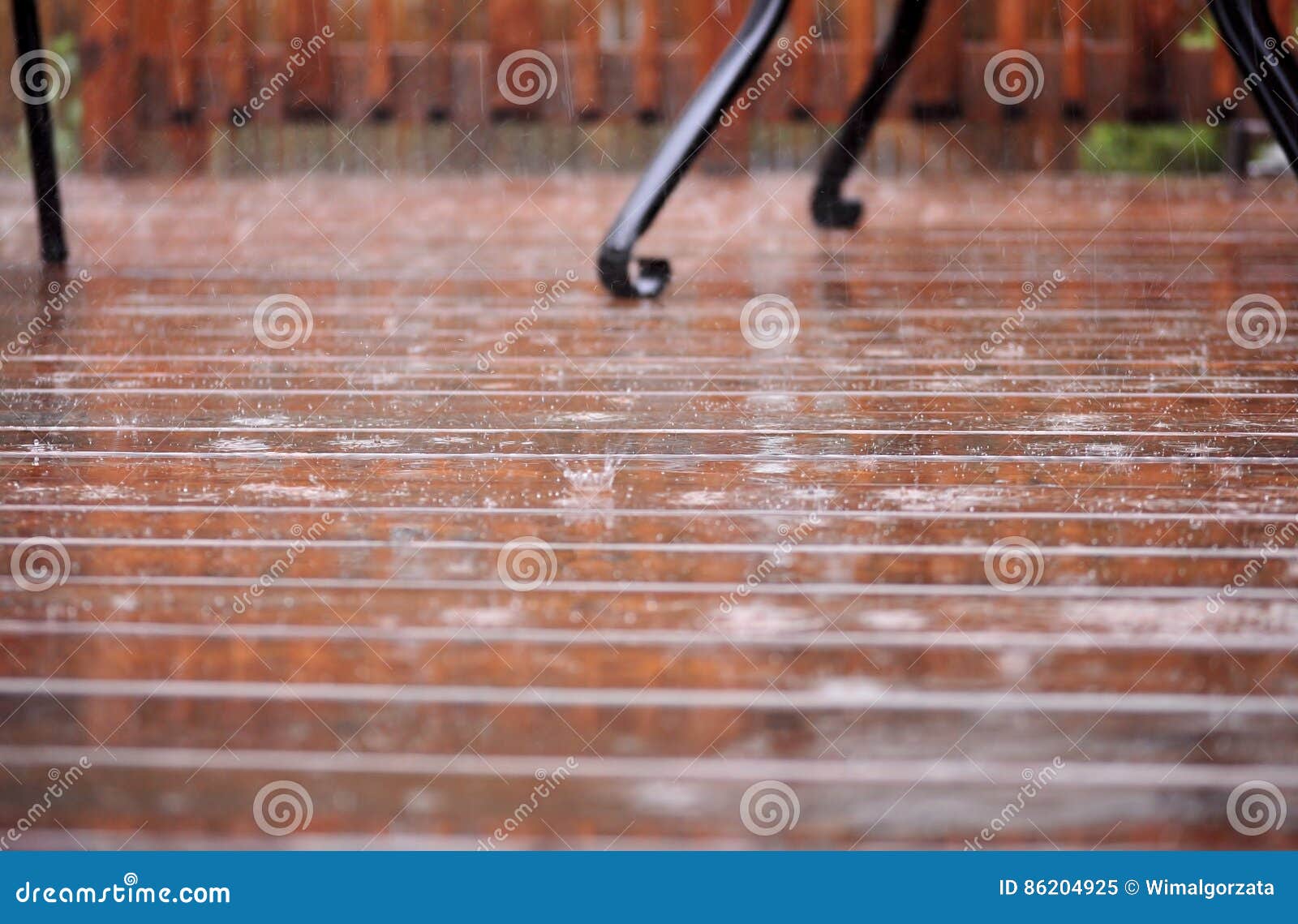 Patio/ deck in heavy rain. stock image. Image of focus - 86204925