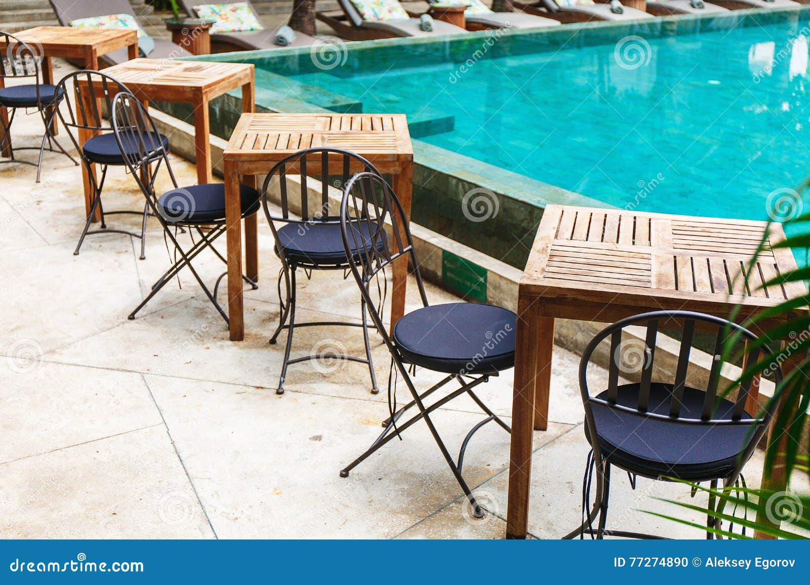 Patio near pool stock photo. Image of furniture, beautiful - 77274890
