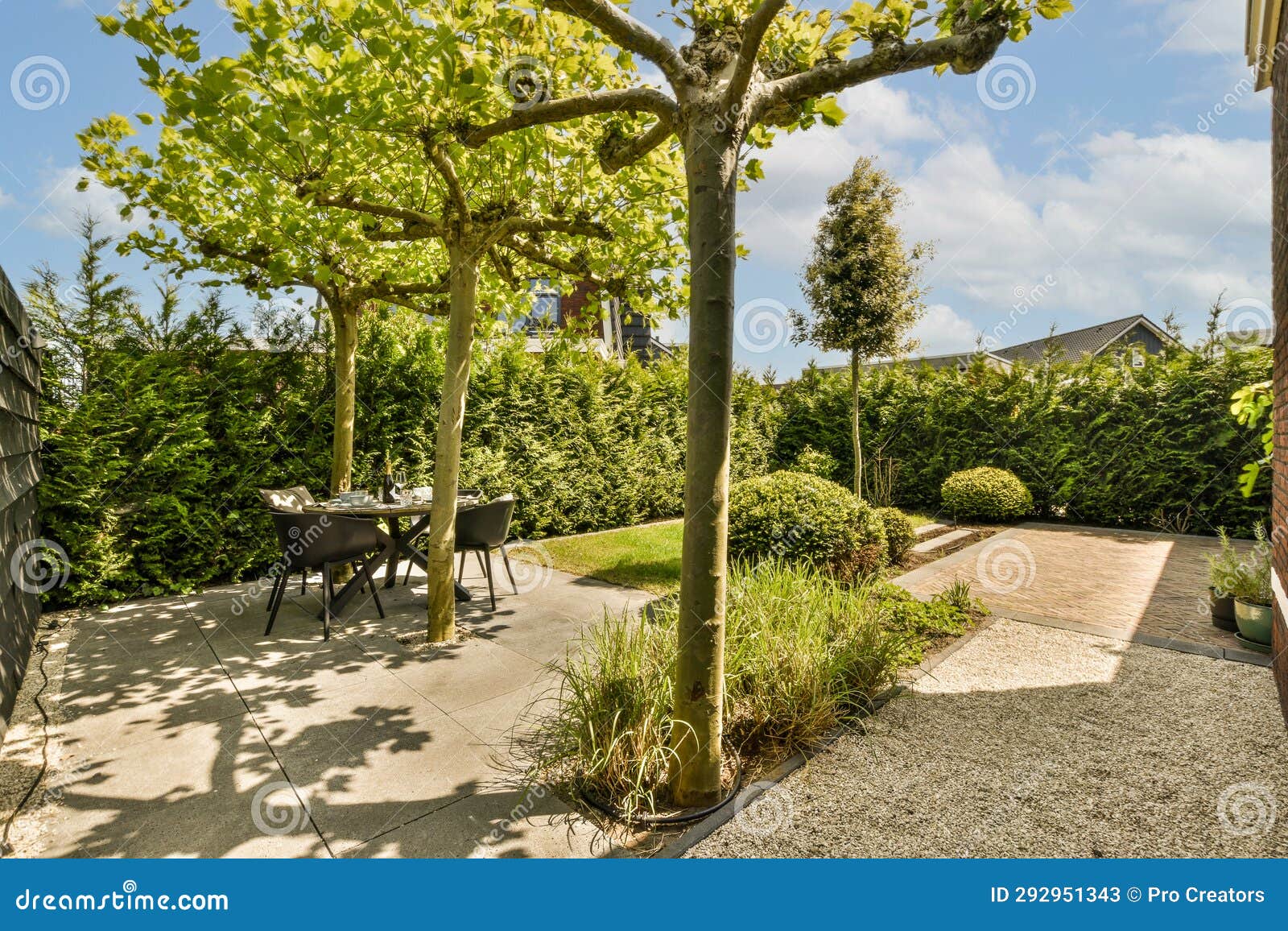 A Patio with a Table and Chairs and Trees Stock Image - Image of rural ...