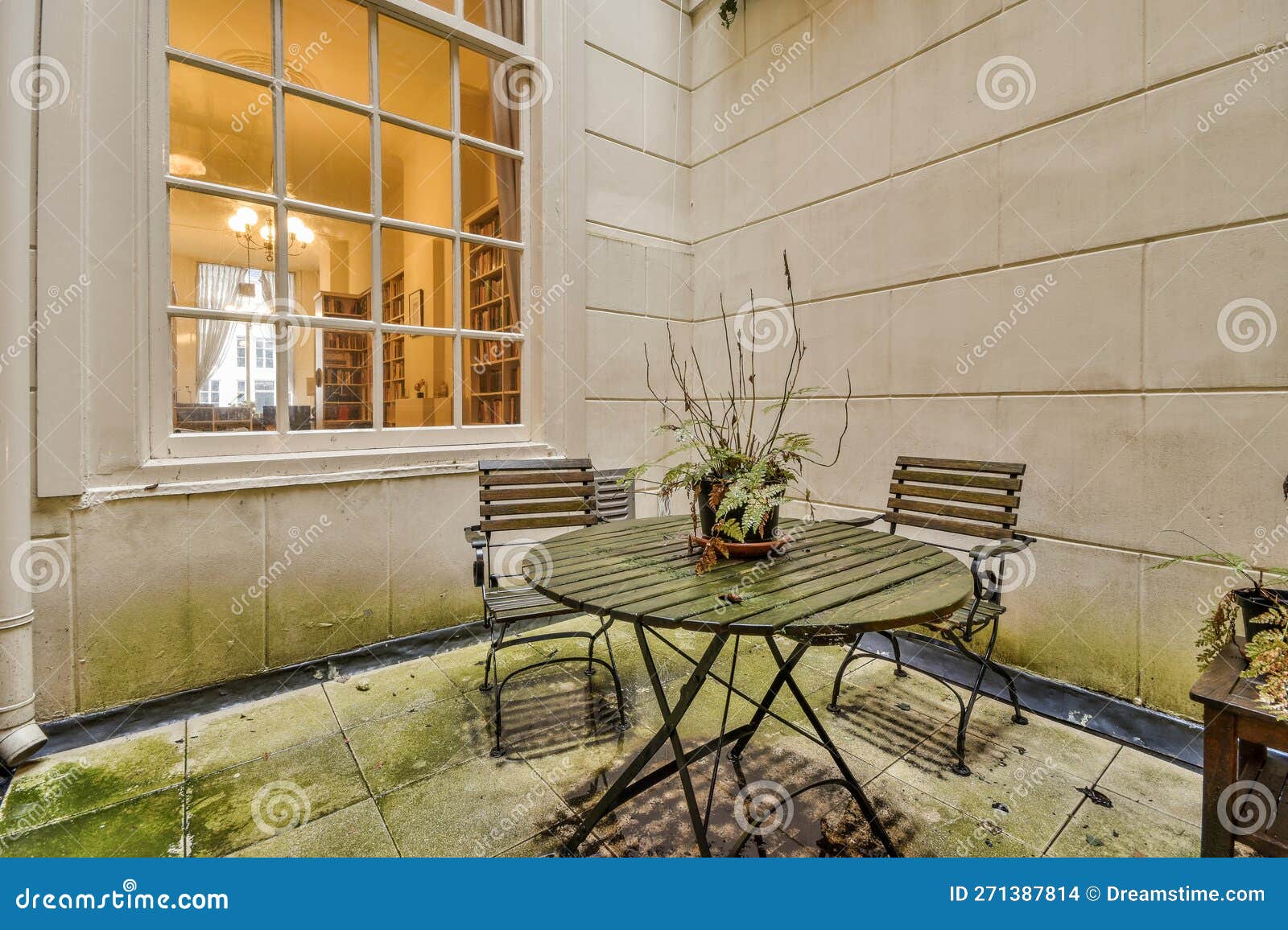 A Patio with a Table and Chairs and a Window Editorial Stock Image ...