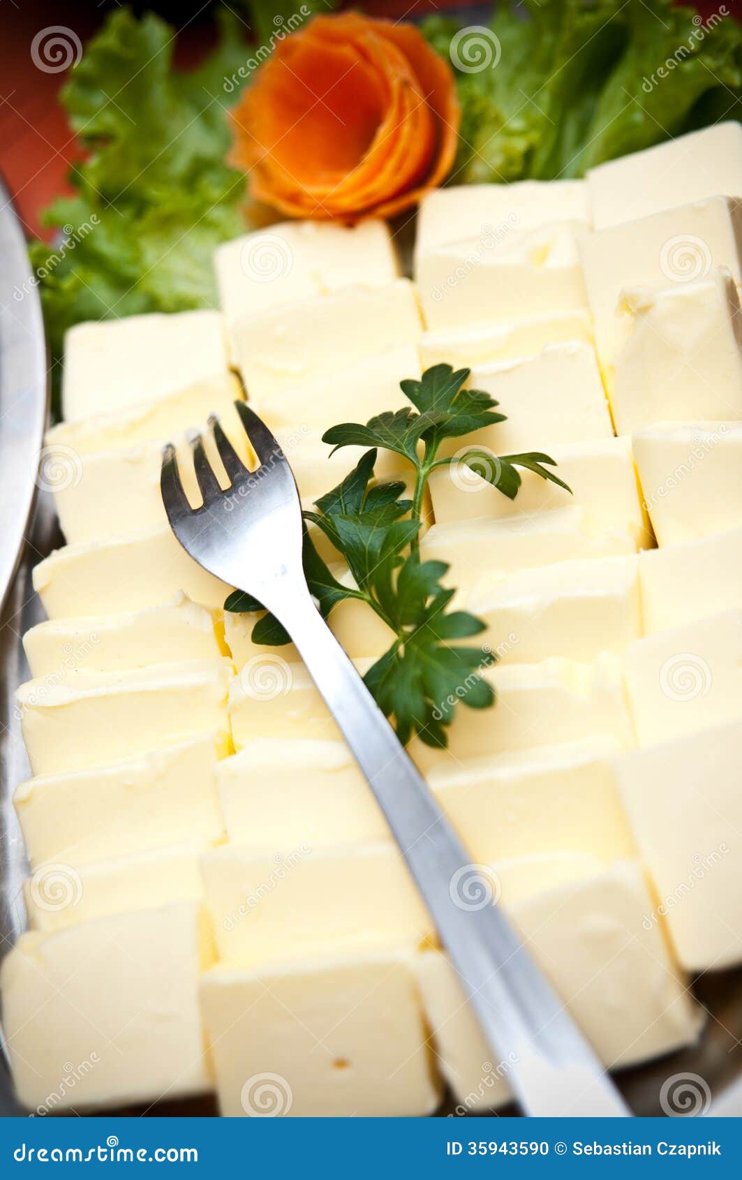 Pats of butter with fork stock photo. Image of rose, fork - 35943590