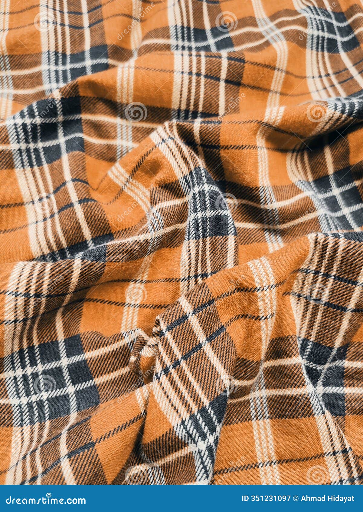 The Pattern and Background of the Fabric Has a Orange Checkered Motif ...