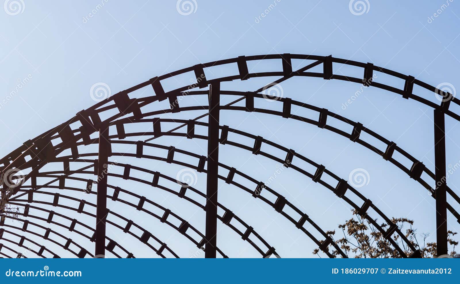 A Pattern of Curved Steel Structures Against a Blue Sky Stock Image ...